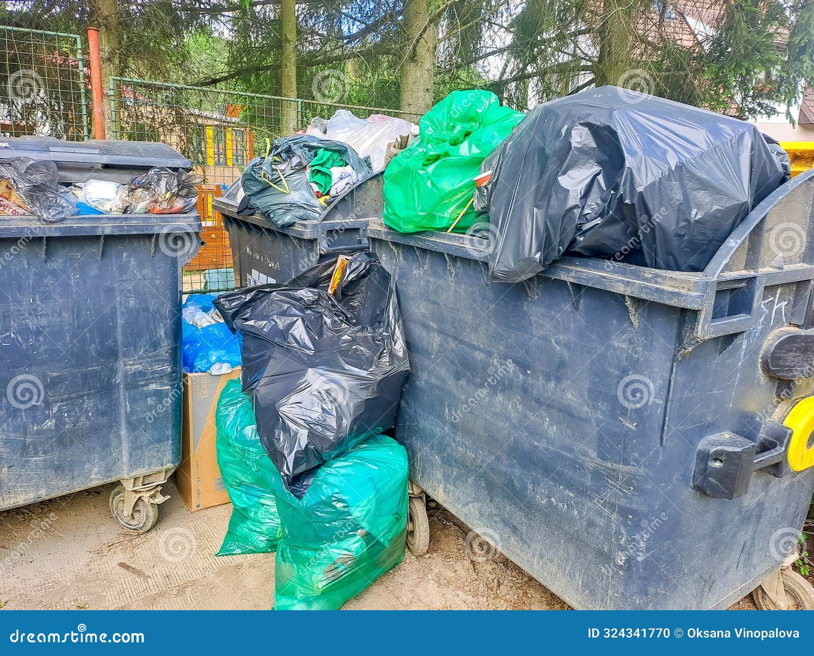 Dumpsters Being Full with Garbage. Trash Can Overflowing Litter ... Dumpsters Being Full with Garbage. Trash Can Overflowing Litter ...
