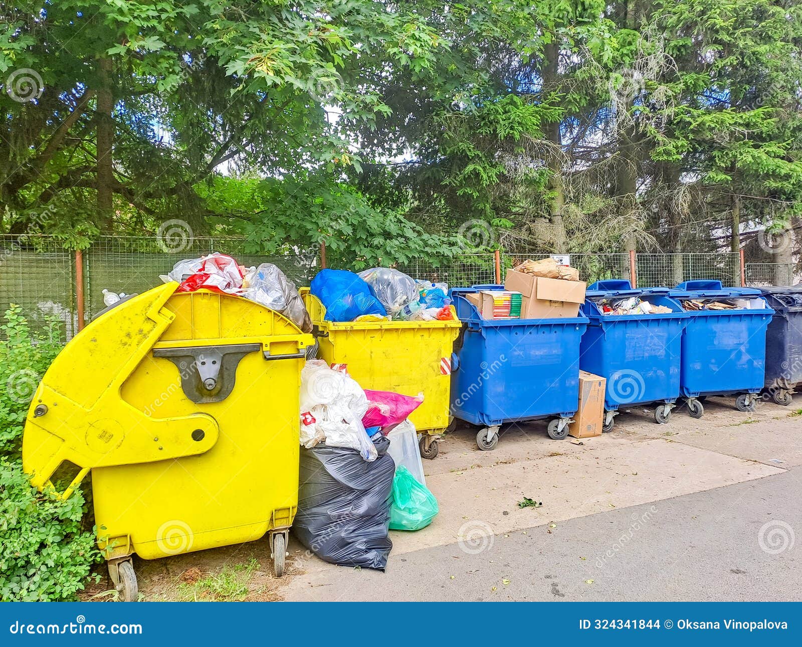 Dumpsters Being Full with Garbage. Trash Can Overflowing Litter ... Dumpsters Being Full with Garbage. Trash Can Overflowing Litter ...