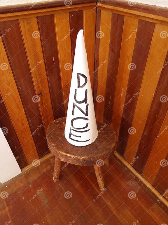 Dunce Cap on Stool in Corner of Room Stock Image - Image of response ...