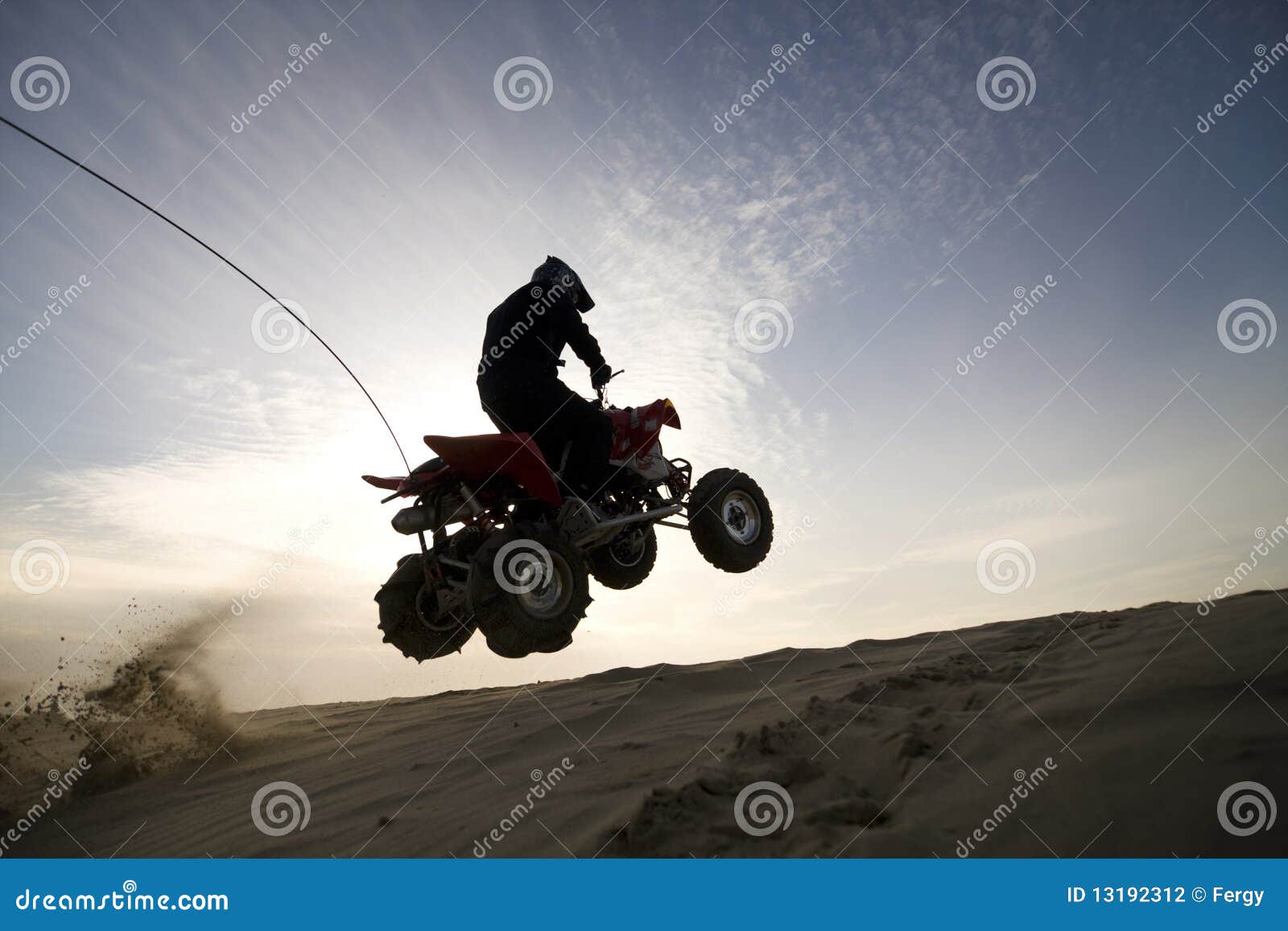 Dune Atv Jump in the Sunset Stock Photo - Image of clouds, lens: 13192312