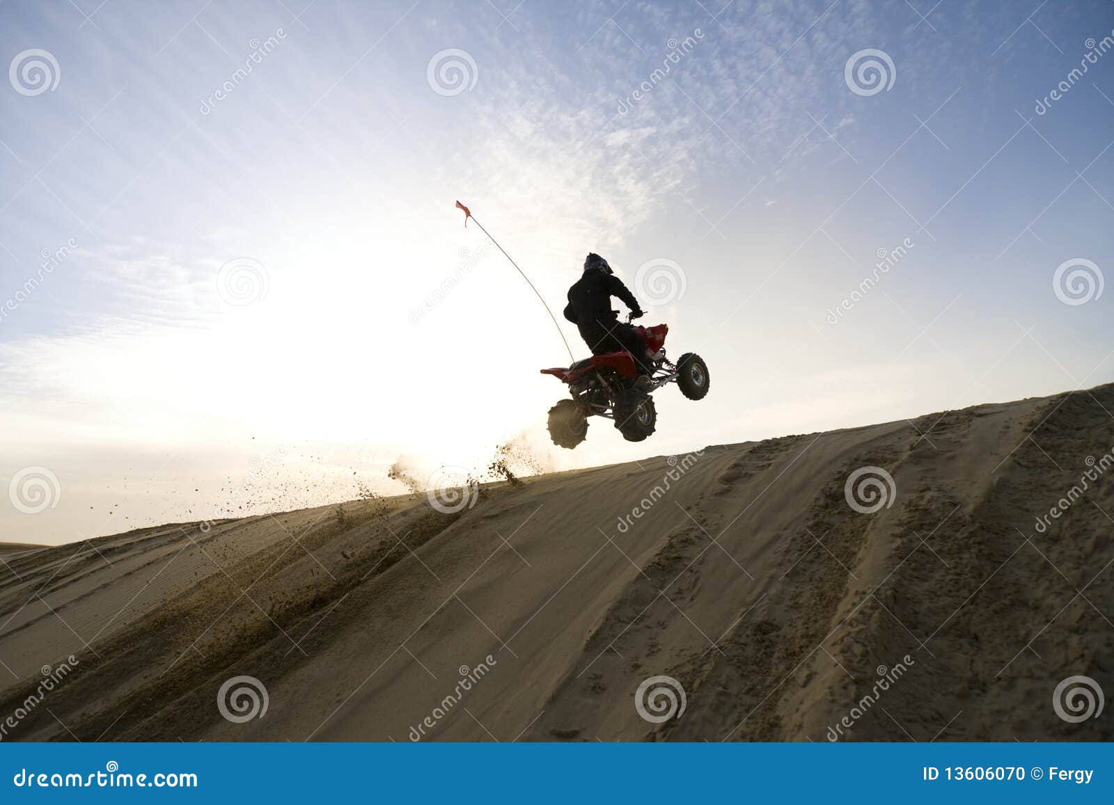 Dune riding in the sunset stock photo. Image of helmet - 13606070