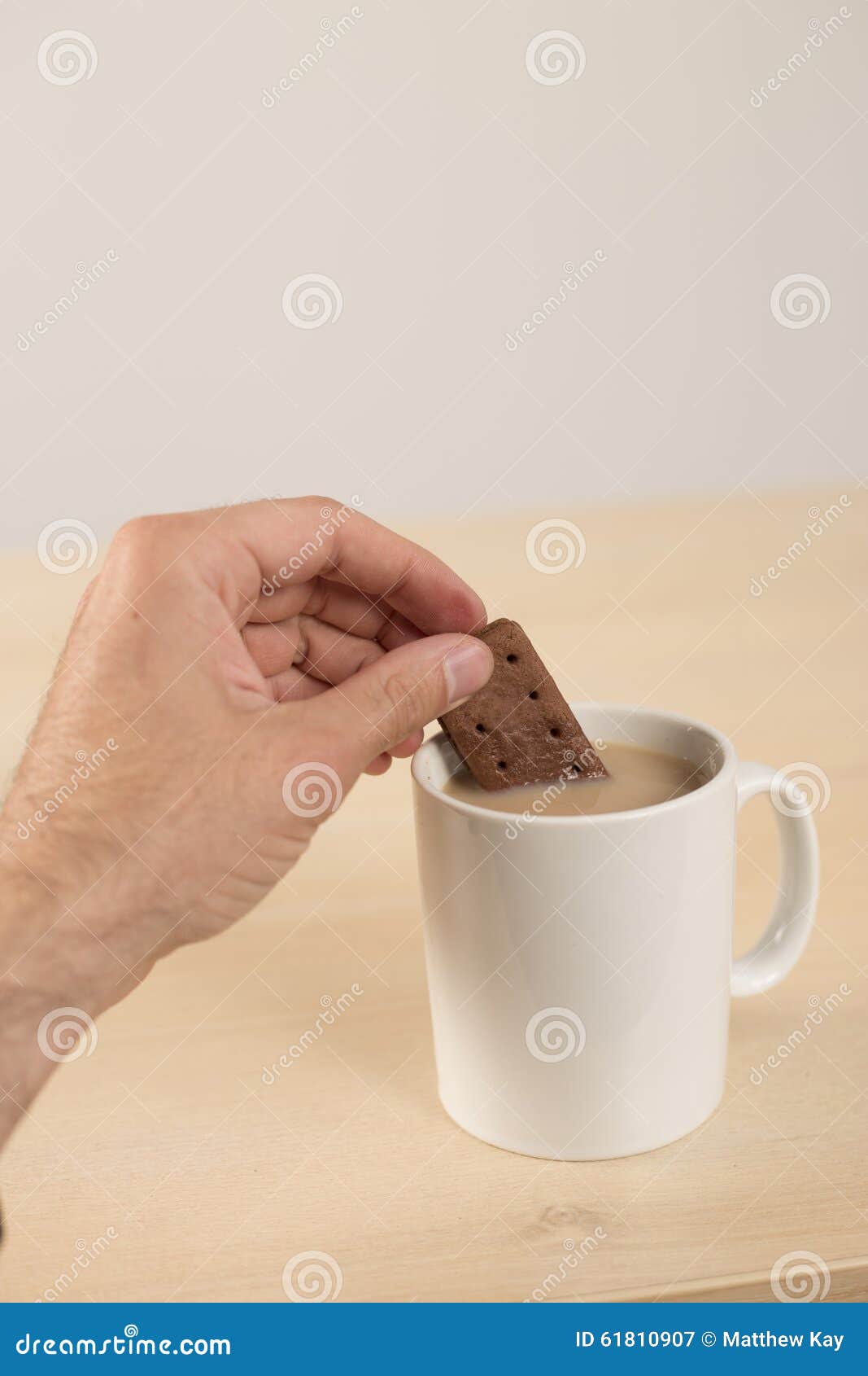 Dunking biscuit in tea stock image. Image of afternoon - 61810907