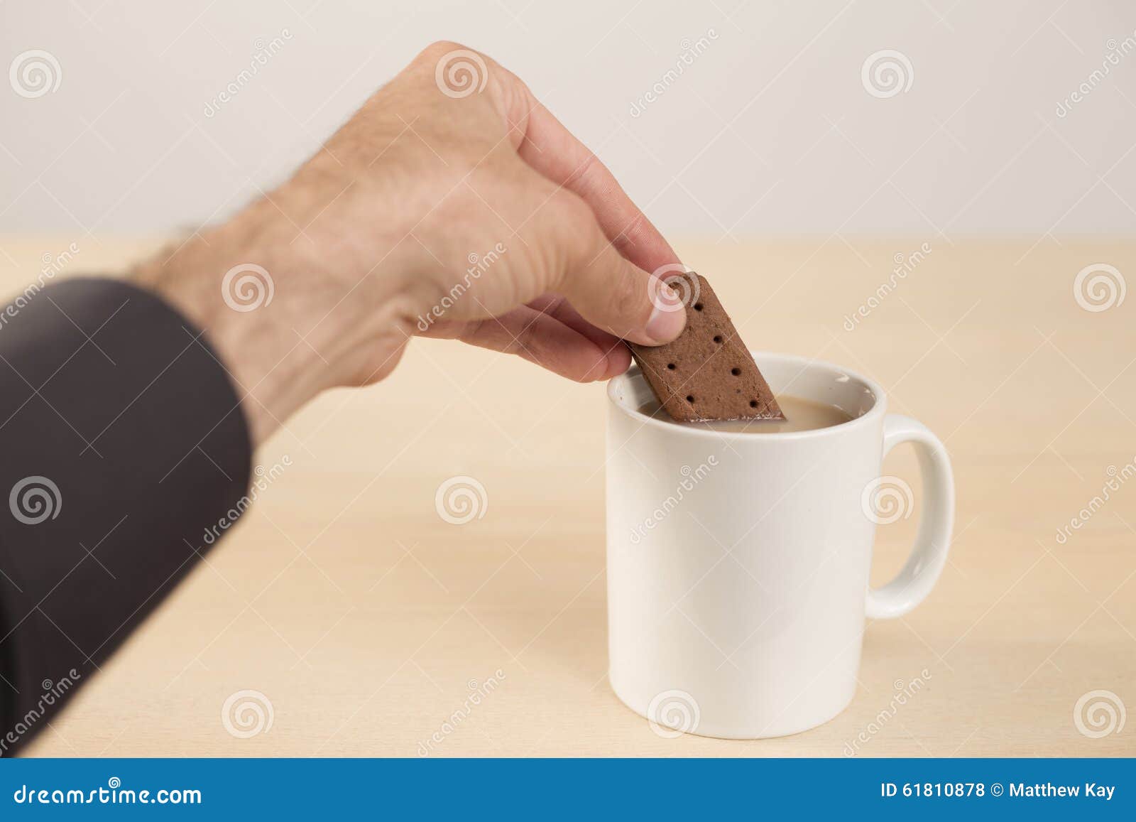 Dunking a Chocolate Biscuit into Tea Stock Photo - Image of food ...