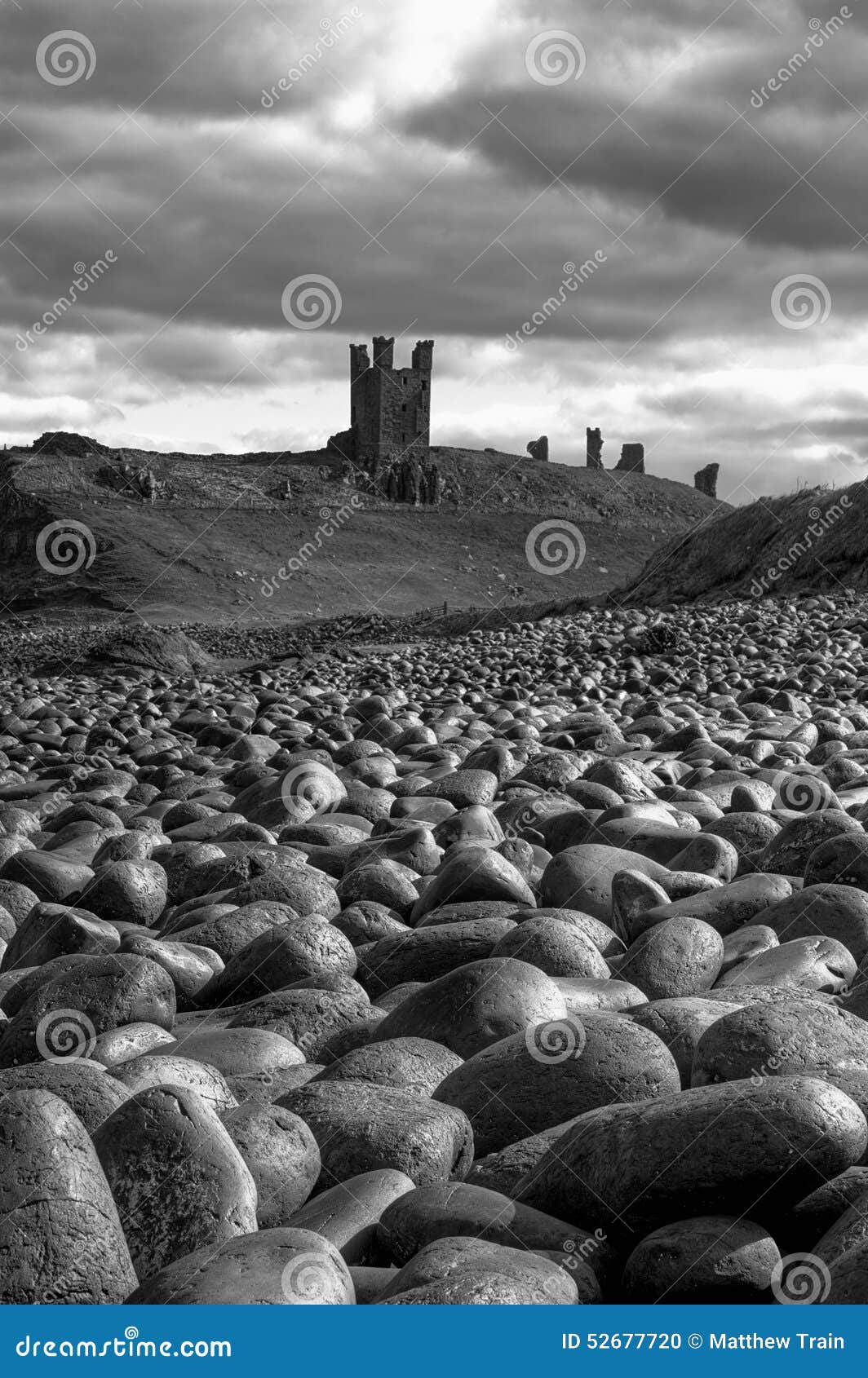 Dunstanburgh Castle Rocks stock photo. Image of ocean - 52677720