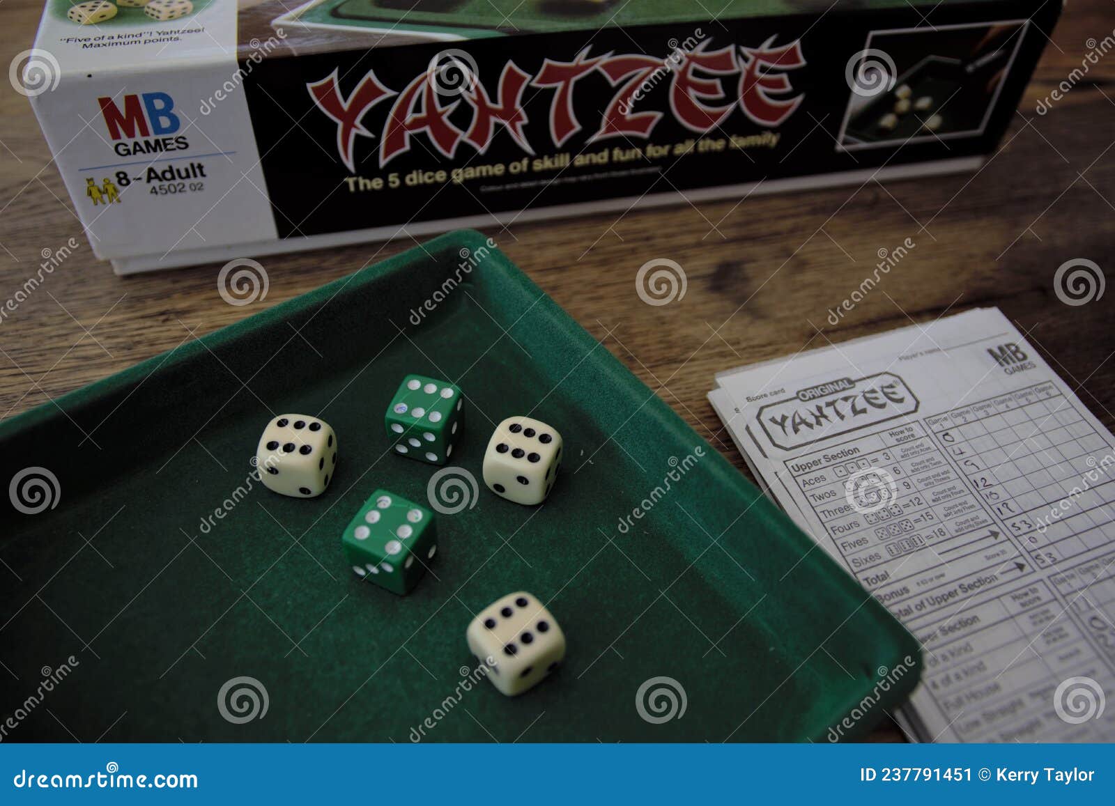 Yahtzee Game In Progress. Rolling Dice, Pencil And Score Sheet On A ...