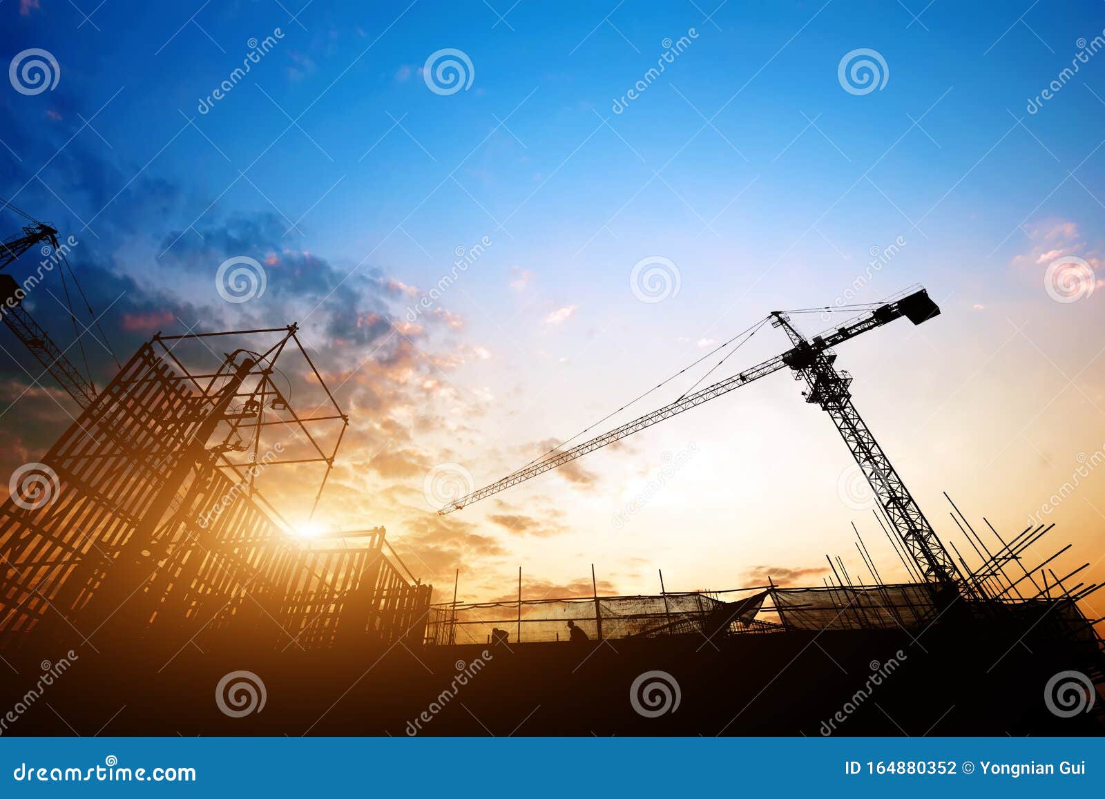 Dusk building site stock photo. Image of modern, scaffolding - 164880352