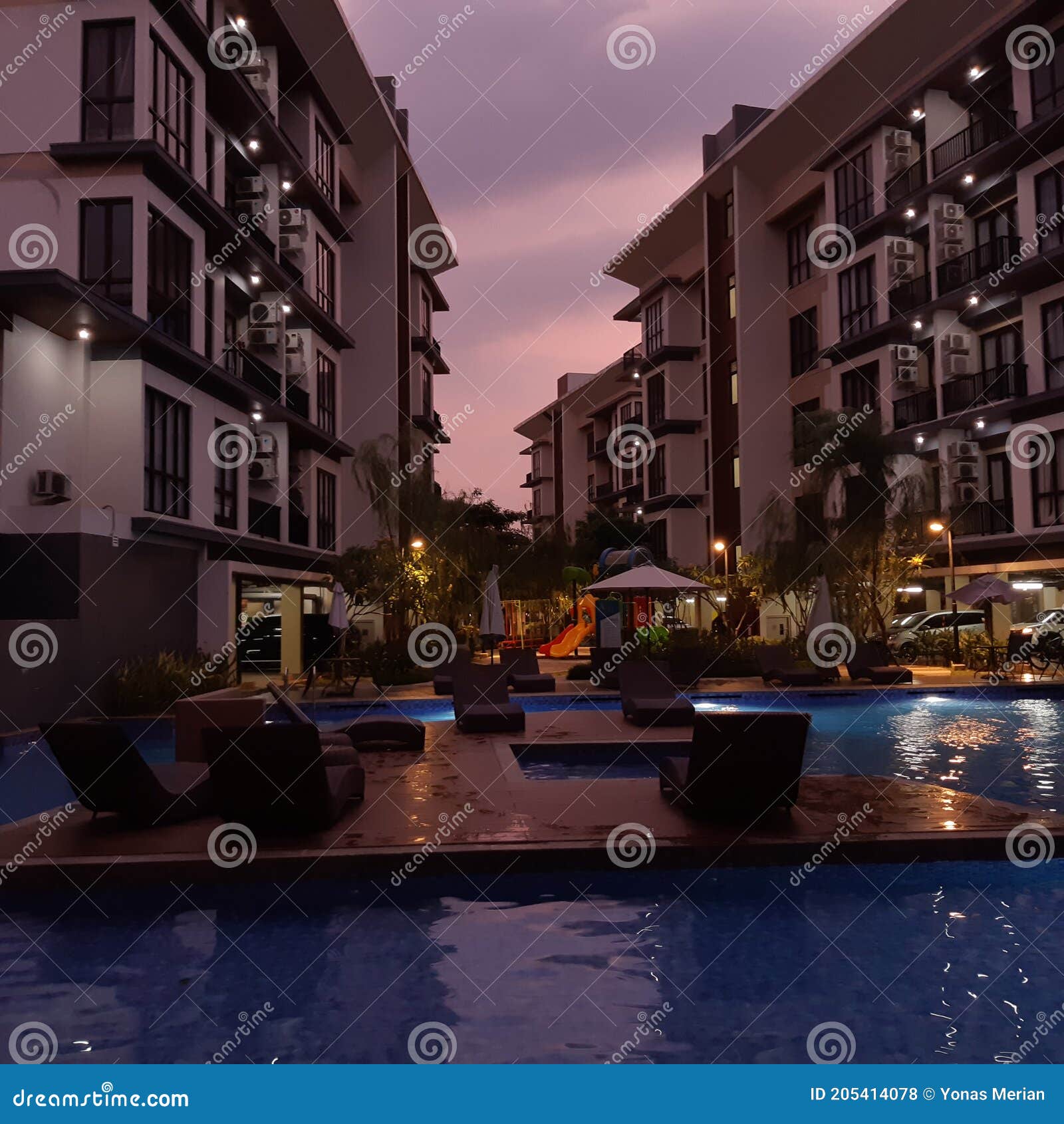 Dusk at the Pool stock photo. Image of aparrment, sunset - 205414078