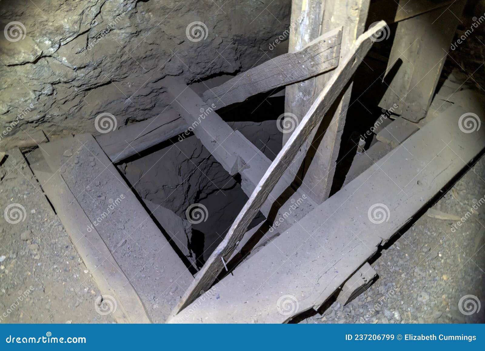 Dust Covered Timbers Protect a Mining Shaft Dug Straight in the Ground ...