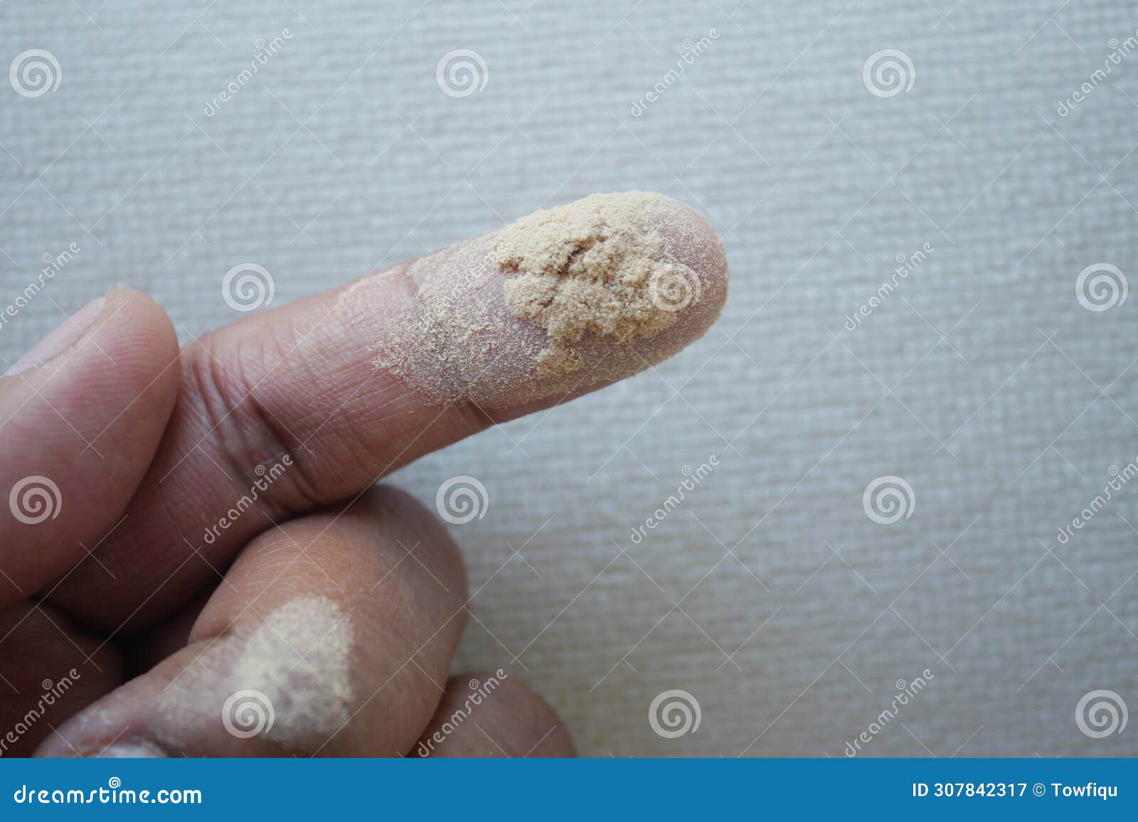 Dust and Dirt on a finger stock image. Image of household - 307842317