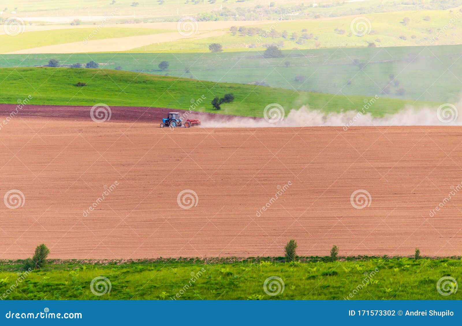 Dust from a Tractor Working in a Field in Spring Stock Photo - Image of ...