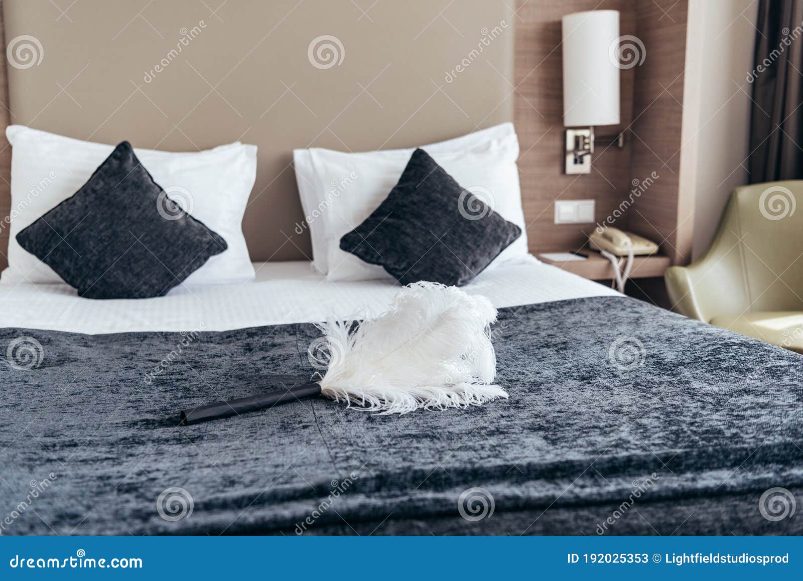 Duster on Bed with Pillows in Hotel Room Stock Image - Image of ...