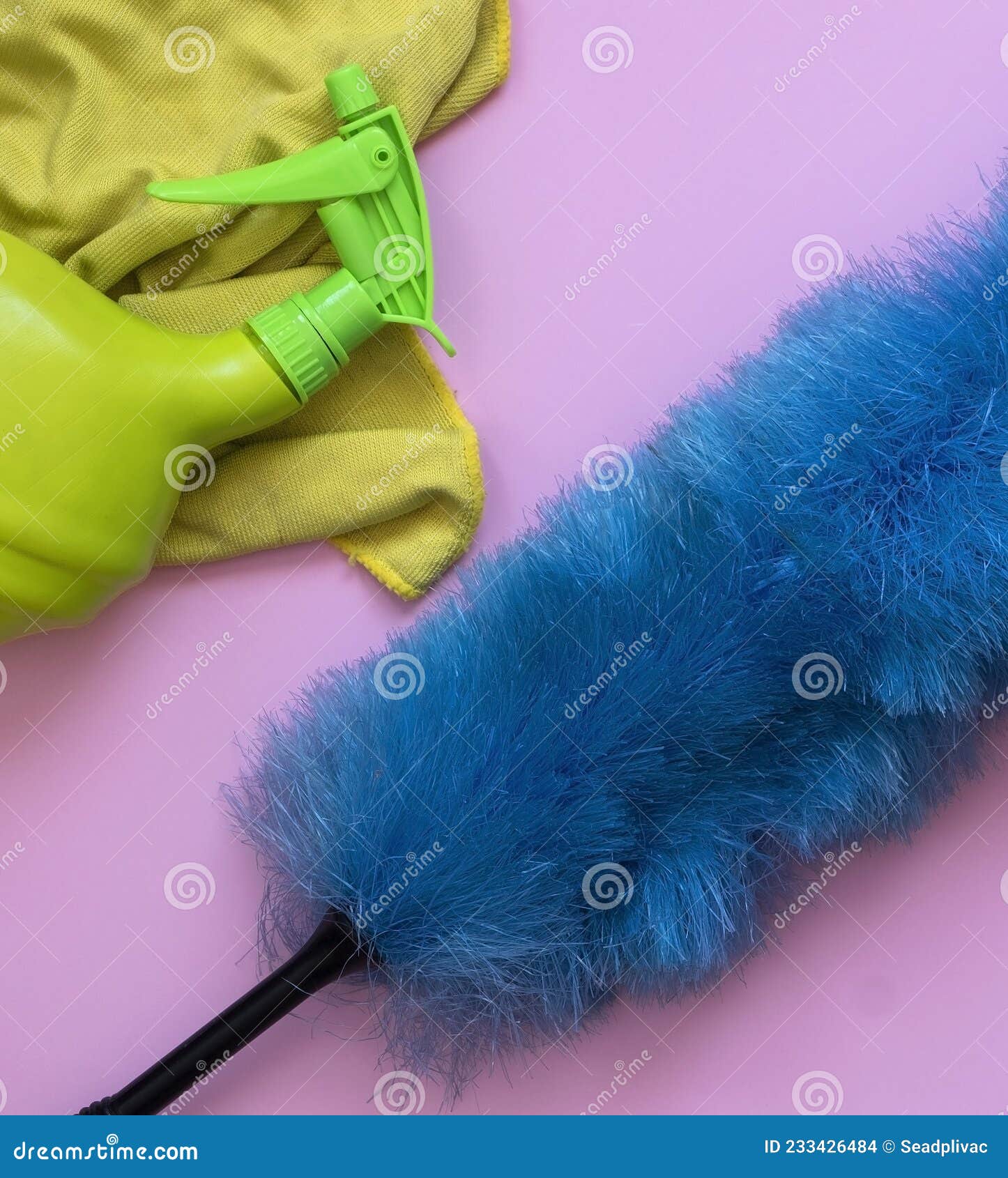 Duster and Spray Bottle on a Pink Background Stock Photo - Image of ...