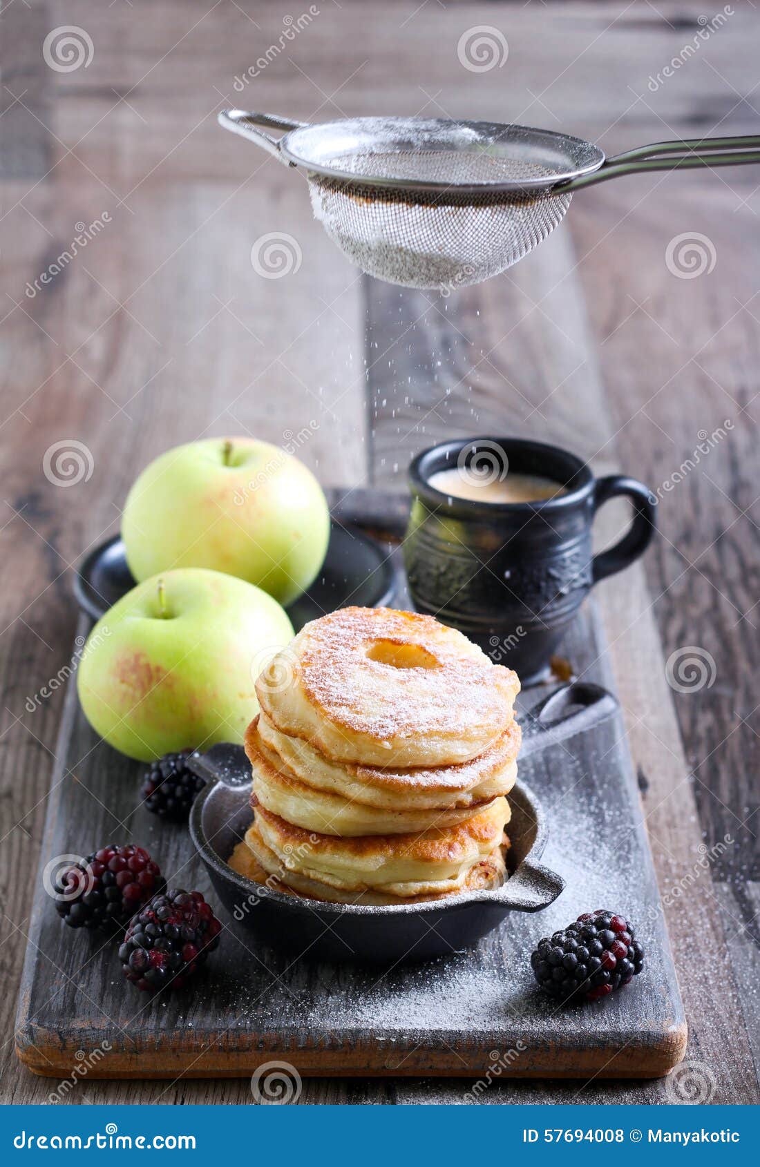 Dusting with Icing Sugar Over Apple Fritters Stock Photo - Image of ...
