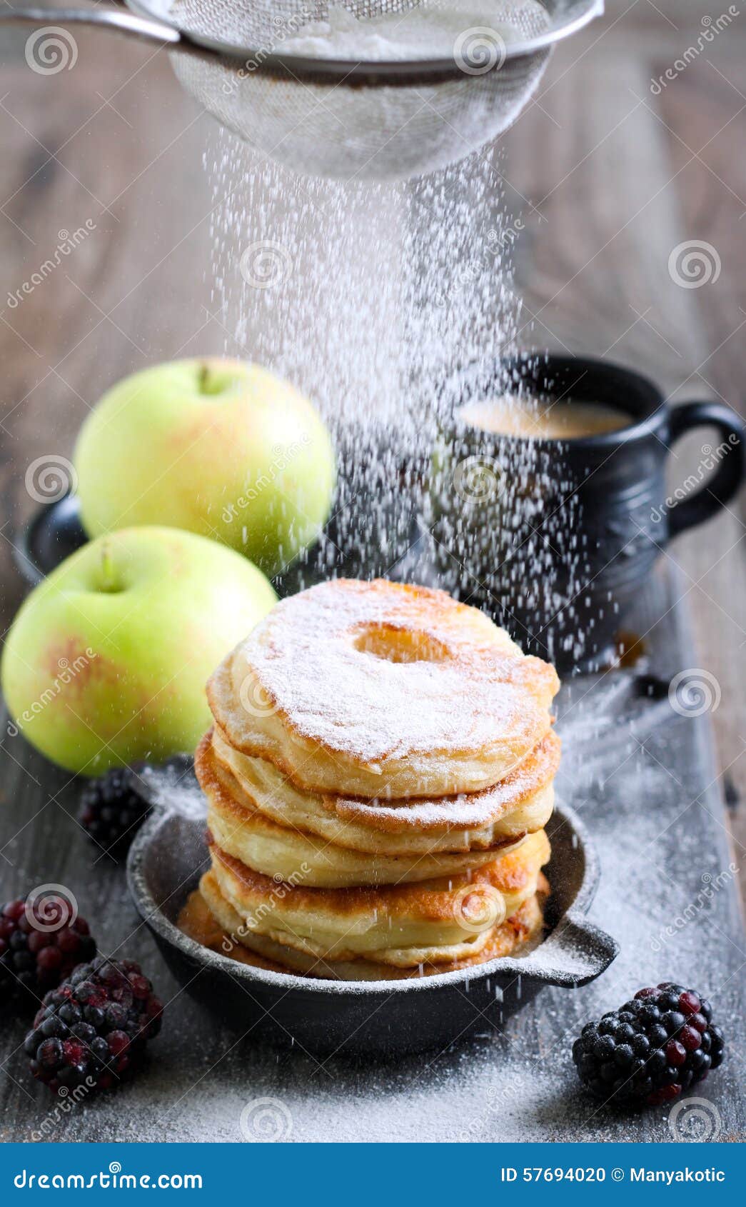 Dusting with Icing Sugar Over Apple Fritters Stock Photo - Image of ...