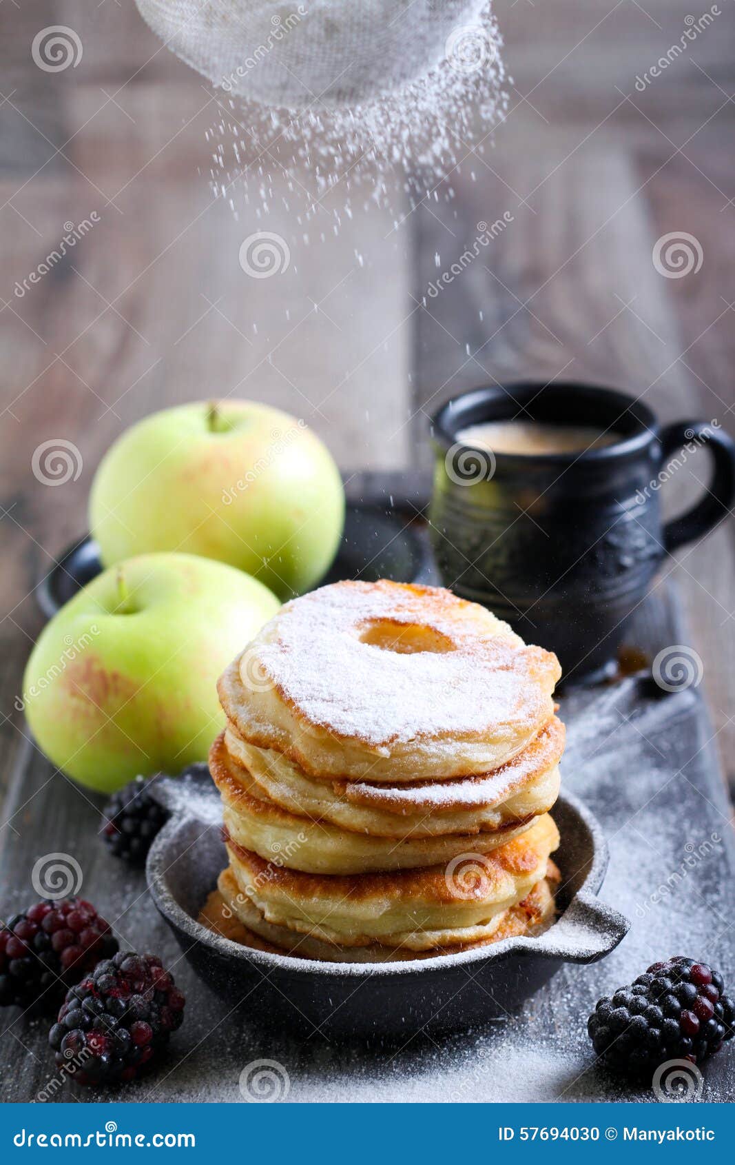 Dusting with Icing Sugar Over Apple Fritters Stock Photo - Image of ...