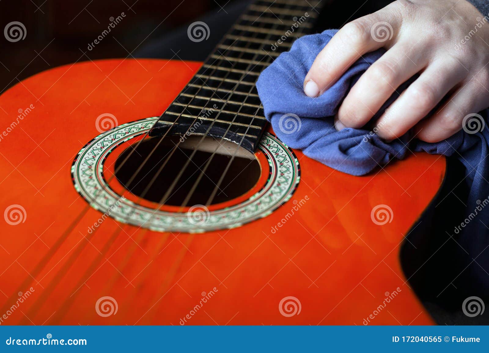 Dusting the Musical Instrument. Rub Wax Acoustic Guitar Stock Image ...