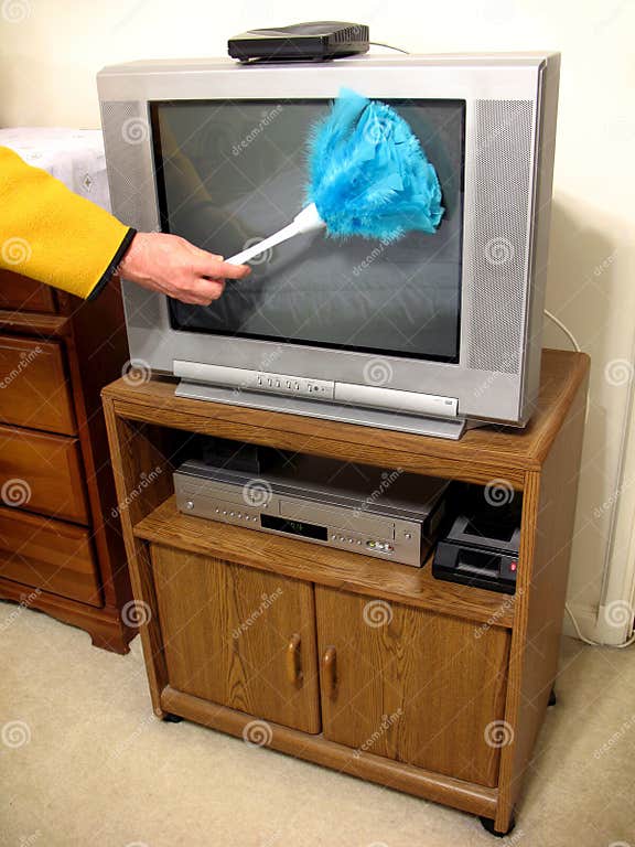 Dusting the TV/VCR Cabinet stock image. Image of cassette - 4652335