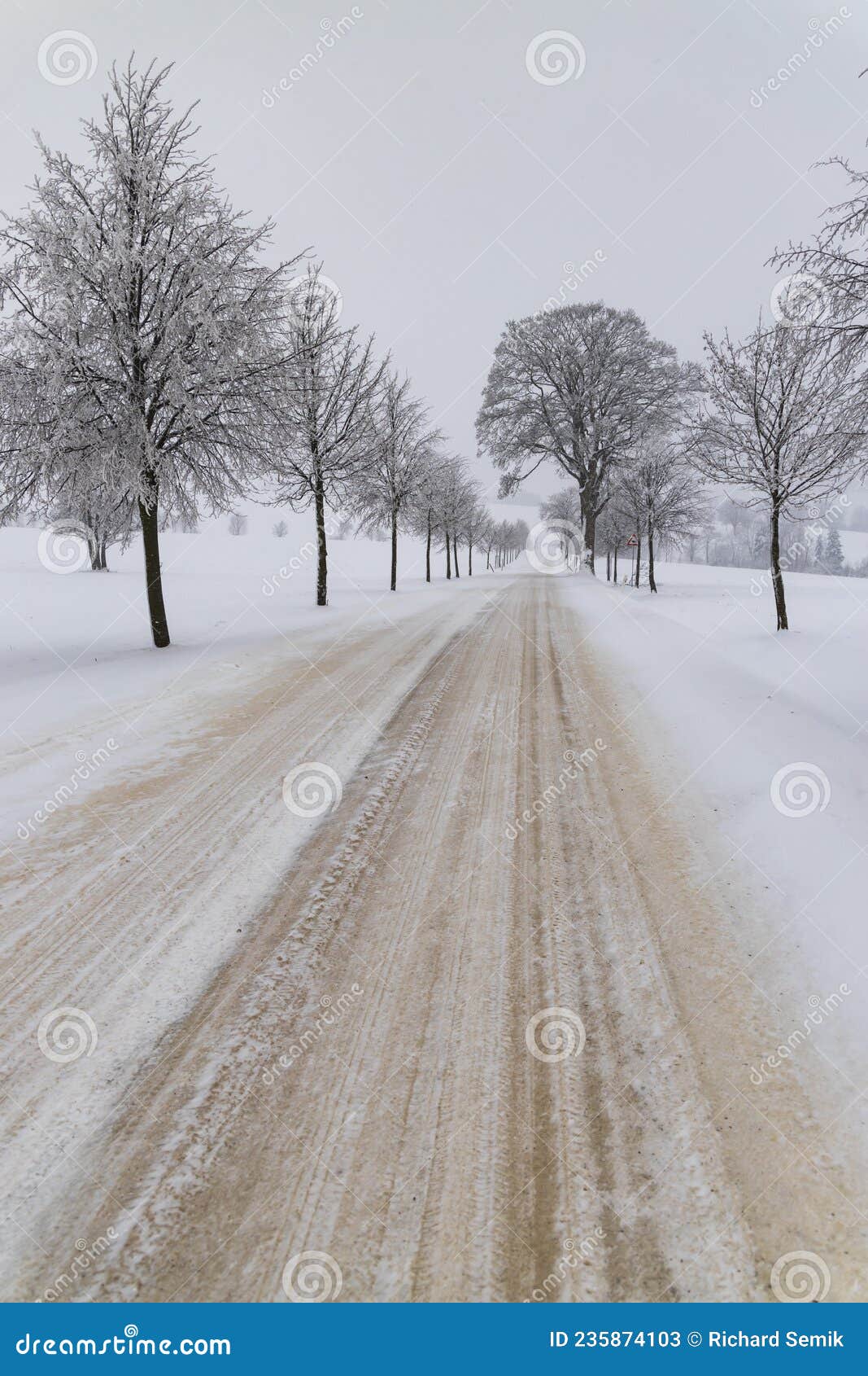 Dusty road with fresh snow stock image. Image of frozen - 235874103