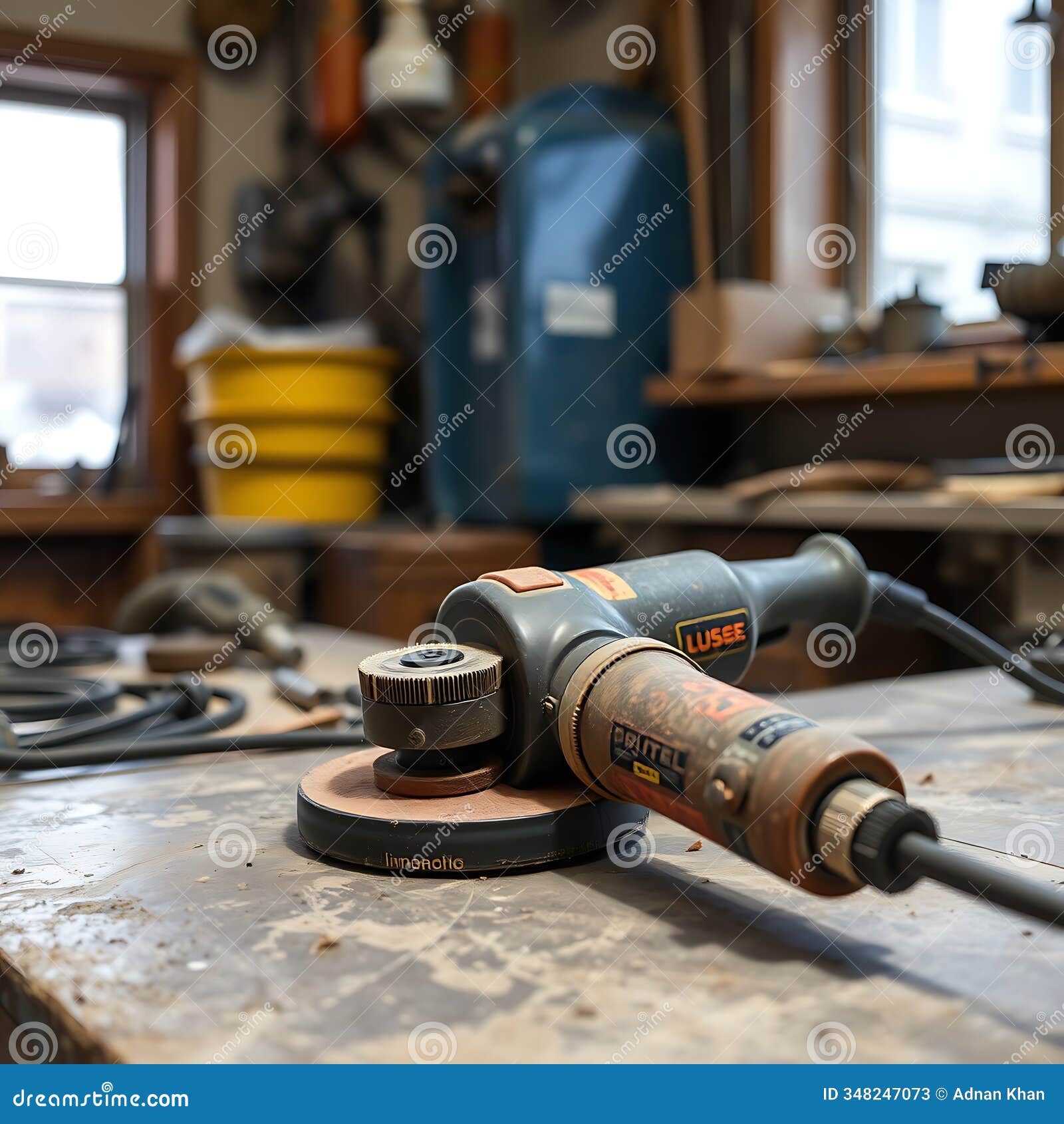A Dusty Workshop with an Industrial Polishing Tool Resting on a ...