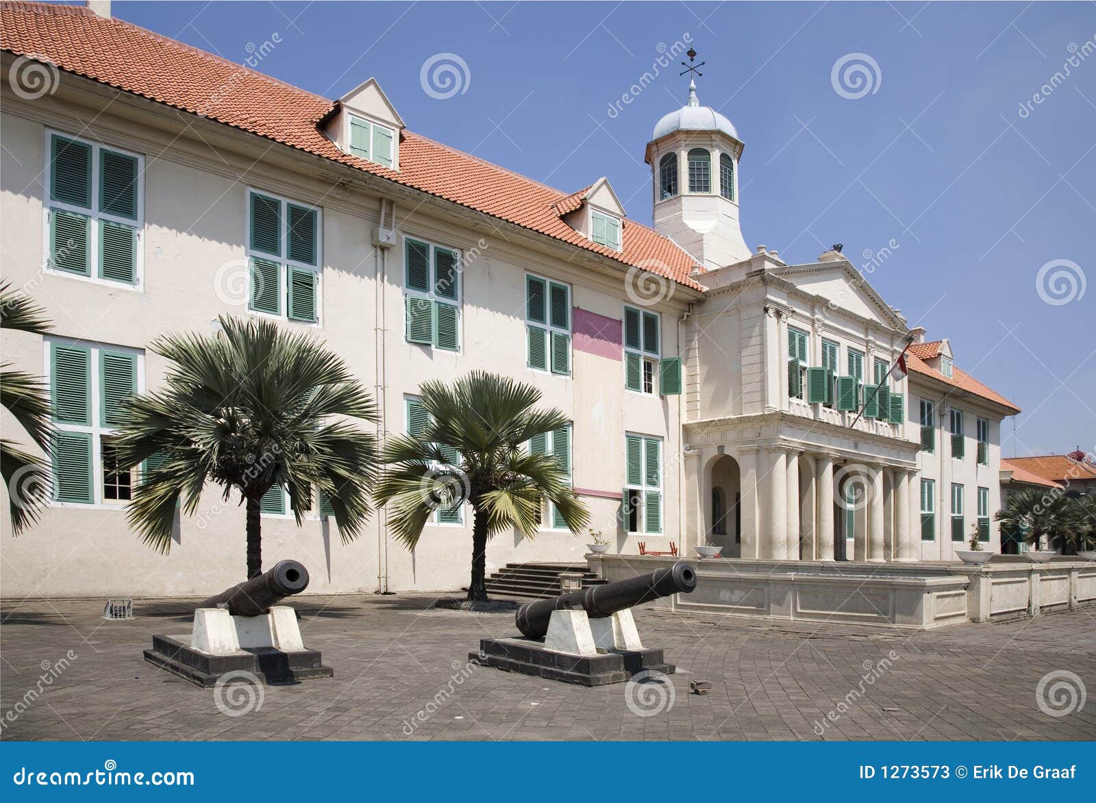 Colonial Building With A White Facade With Green Tiles Surrounded By ...