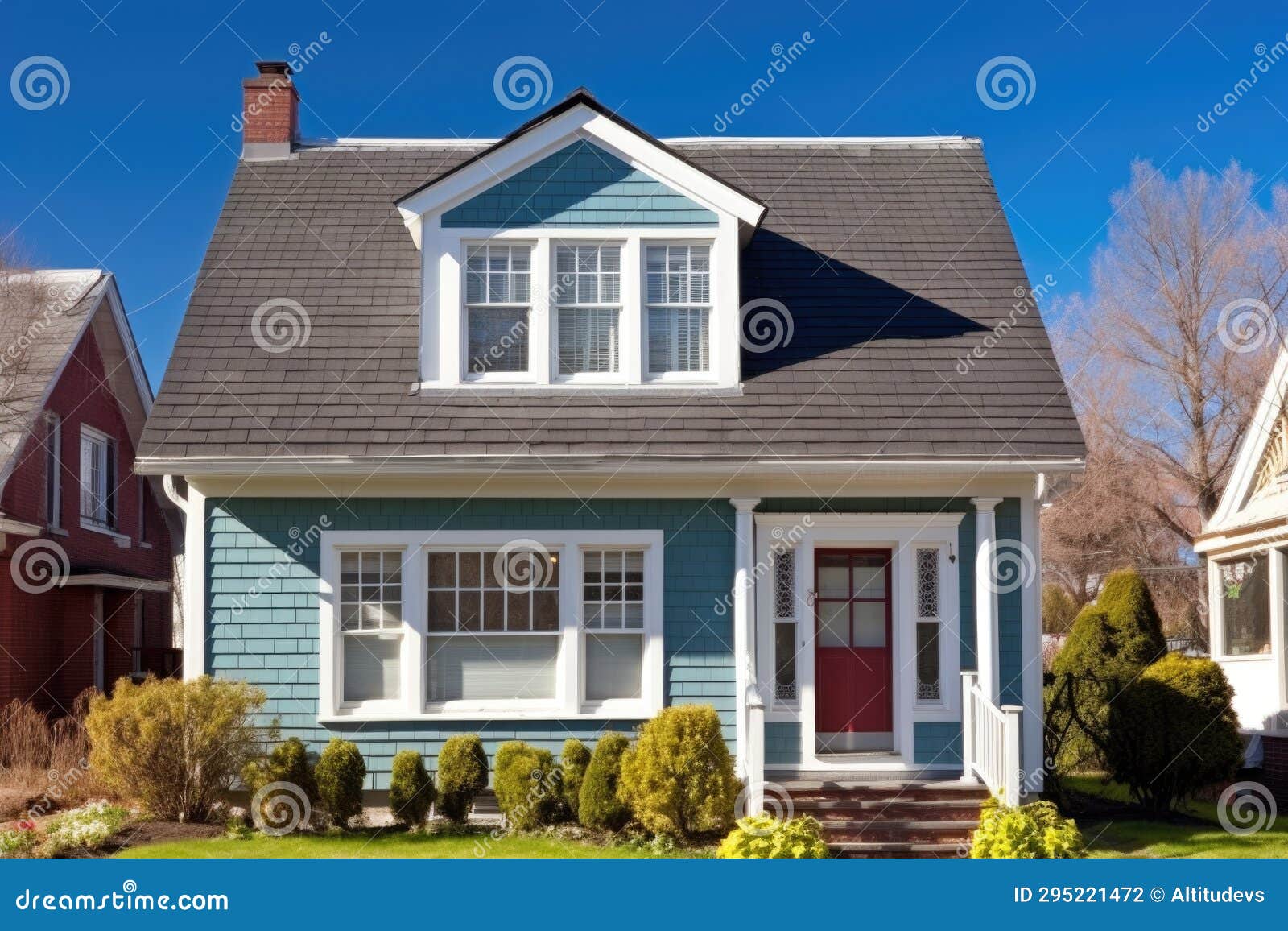 Dutch Colonial with Dormer Windows on a Sunny Day with Clear Blue Sky ...