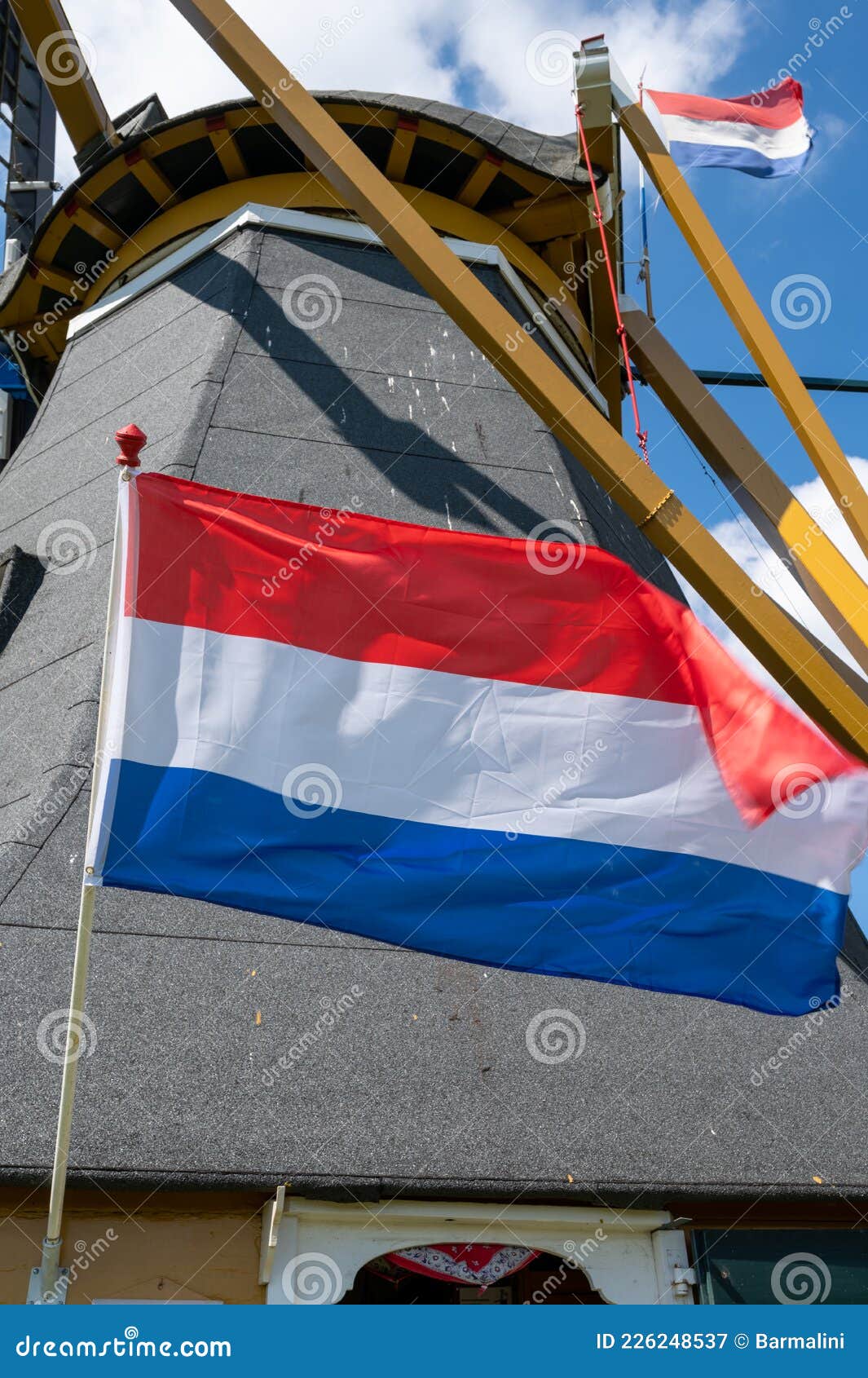 Dutch Flag and Traditional Windmill Used for Grain Grinding on ...