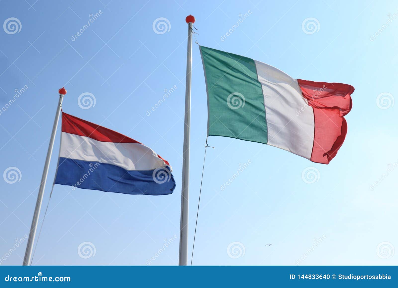 Dutch and Italian flags stock photo. Image of holland - 144833640