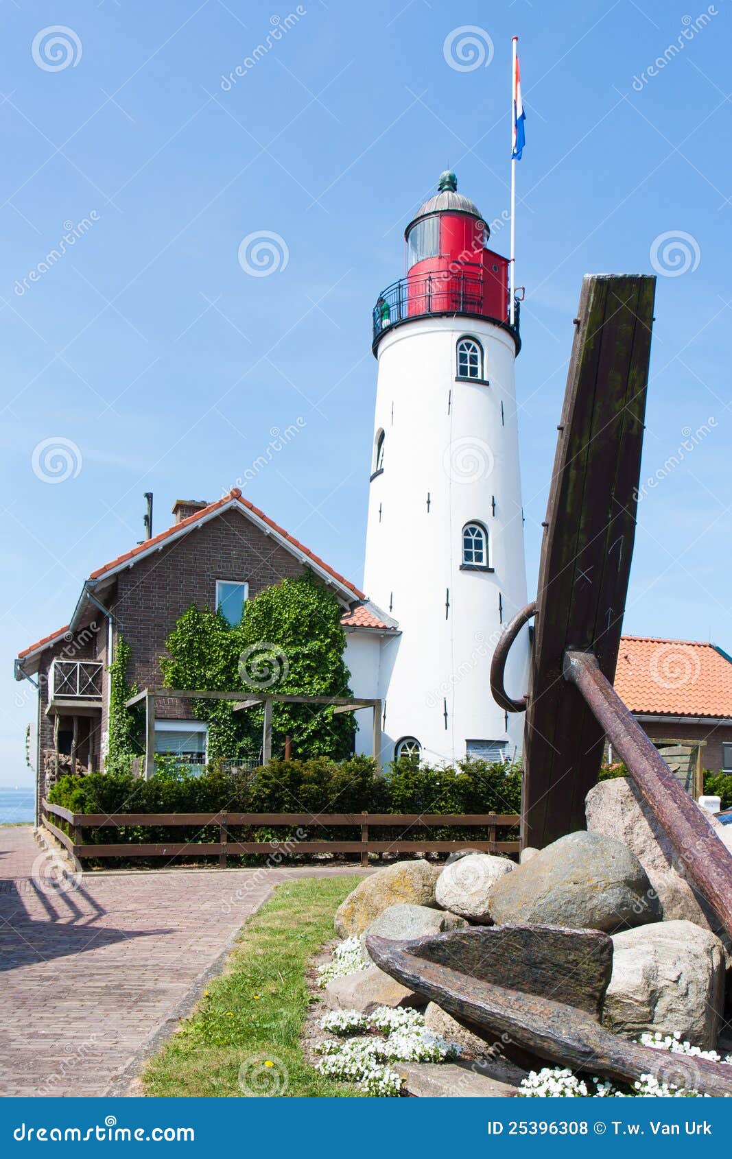 Dutch Lighthouse with a Big Anchor in Front of it Stock Photo - Image ...
