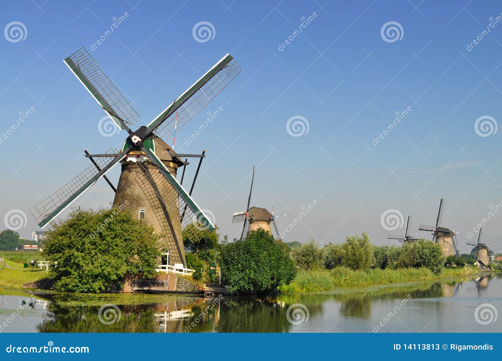 Dutch mills over a river stock image. Image of rural - 14113813