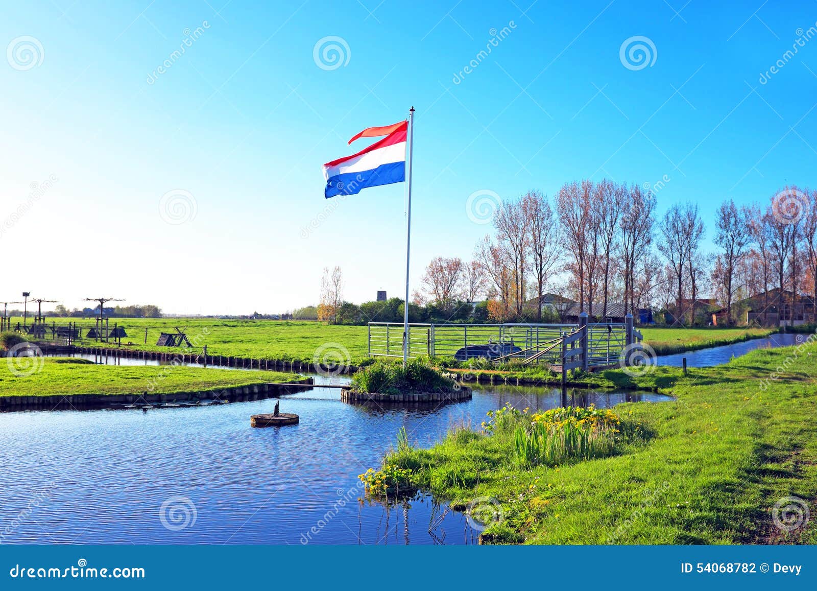The Dutch National Flag in a Dutch Landscape Stock Photo - Image of ...