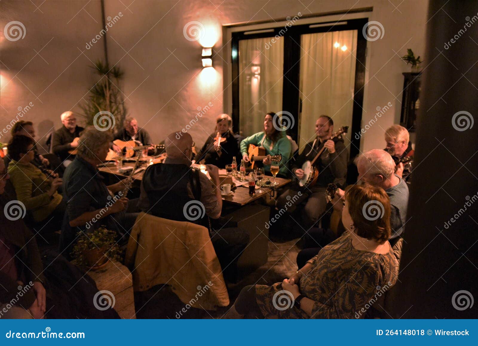Dutch People Sitting at the Table and Playing Musical Instruments in ...