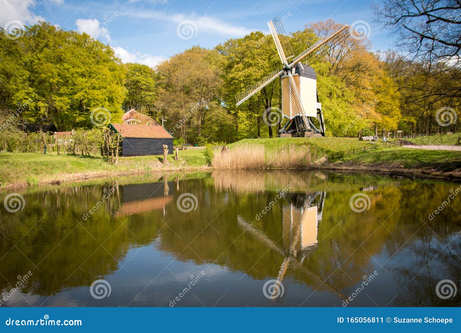 Dutch Post Windmill with Reflection in the Water Stock Image - Image of ...