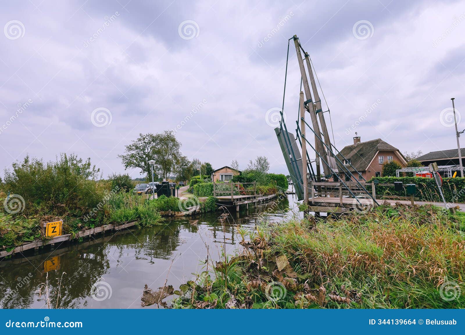 Dutch Rural Scenery, Road and Bridge Over the Canal Stock Photo - Image ...