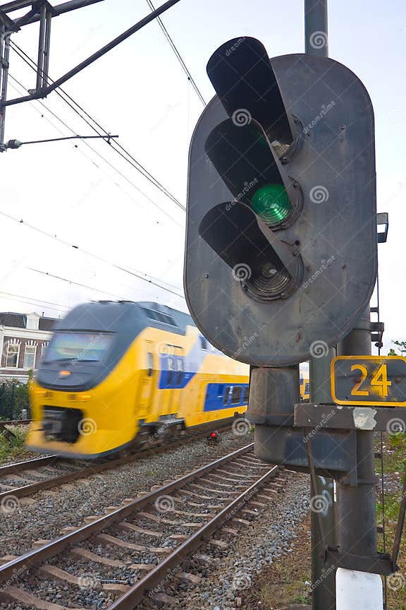 Dutch Train Passing a Railway Sign Stock Photo - Image of cable, iron ...