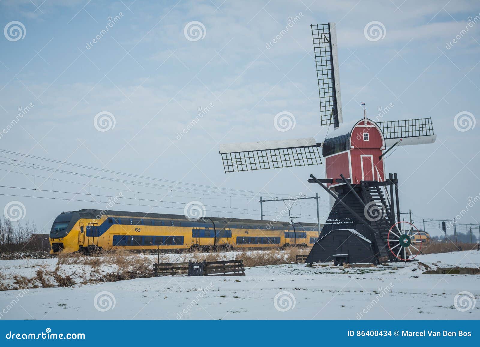 Dutch Train and Windmill in Winter Landscape Editorial Stock Image ...