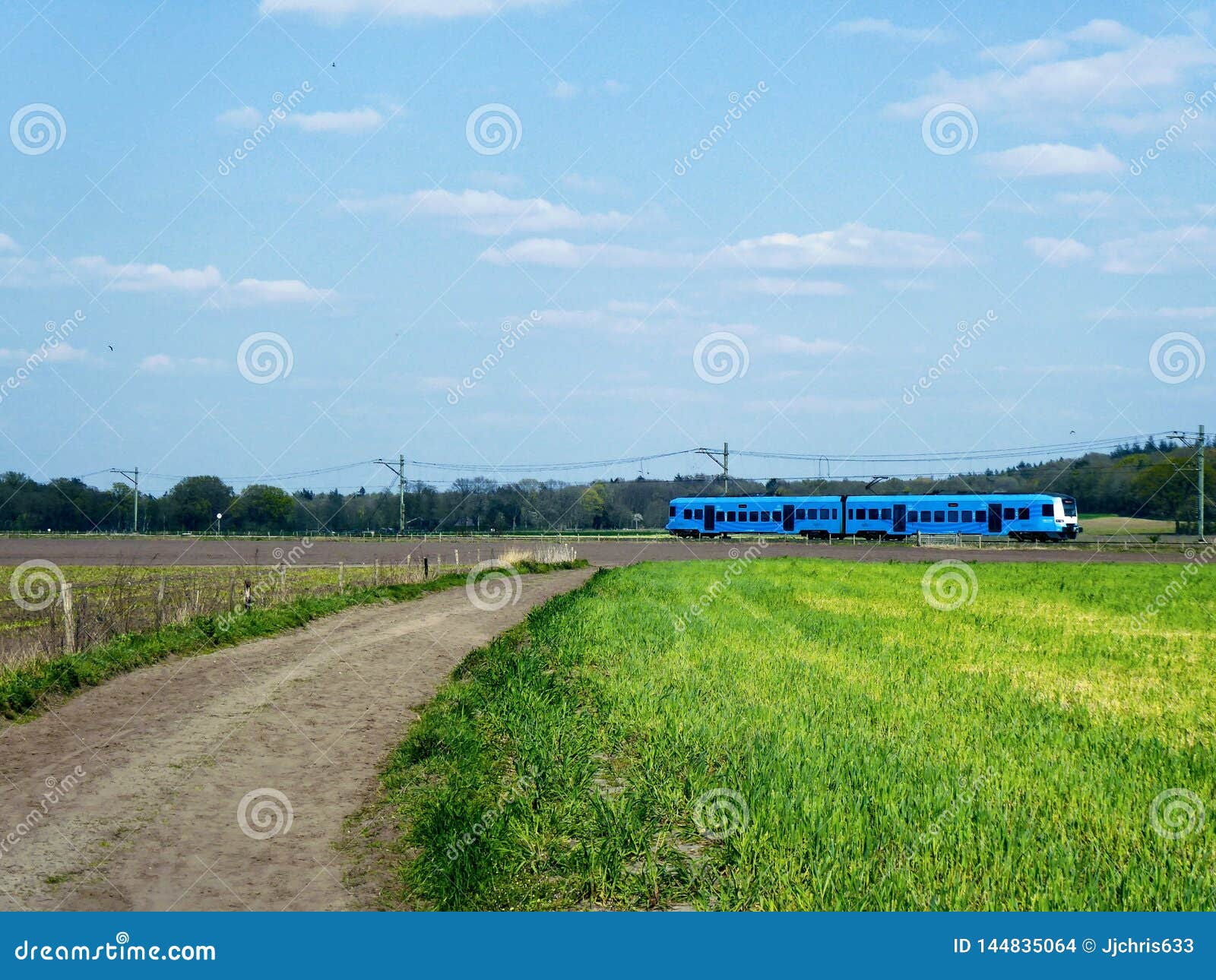Dutch Valeilein Train. Blue Passenger Train. in Farmlands Editorial ...