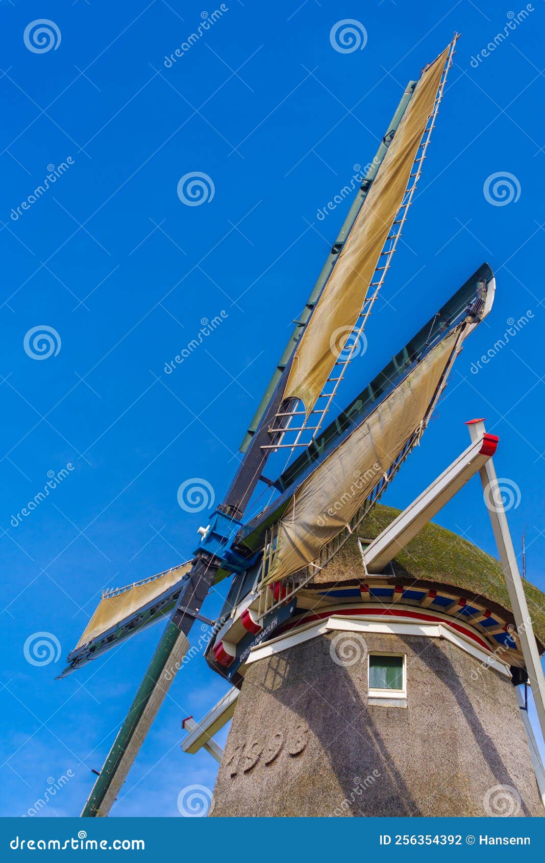 Blades of a dutch windmill stock photo. Image of holland - 256354392
