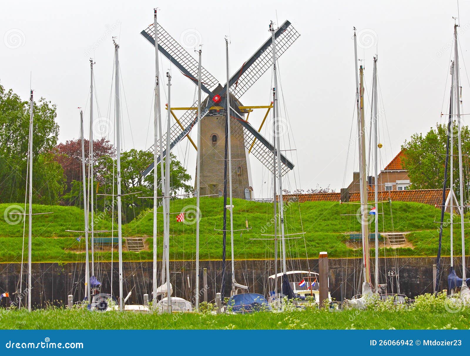 Dutch Windmill and Boats stock photo. Image of masts - 26066942