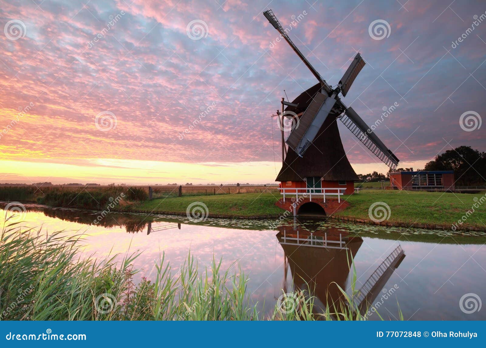 Dutch Windmill by River at Sunrise Stock Photo - Image of groningen ...