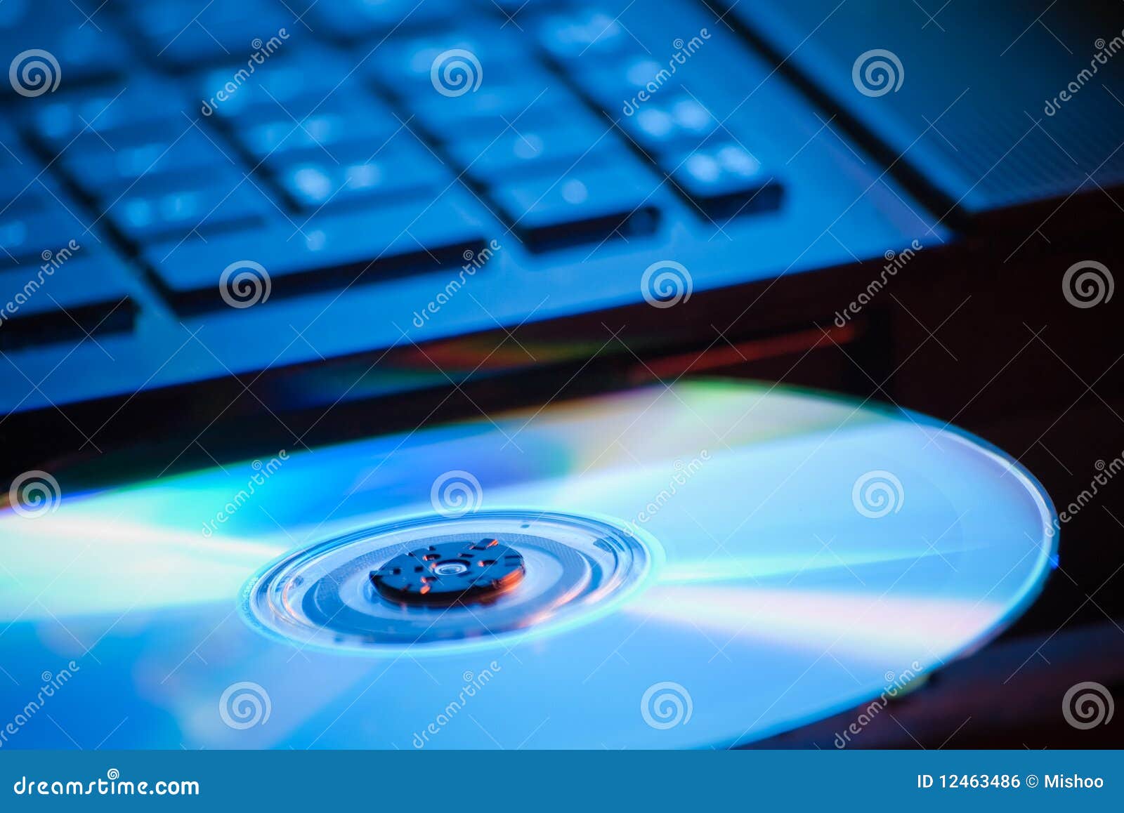 DVD in blue light stock photo. Image of office, closeup - 12463486