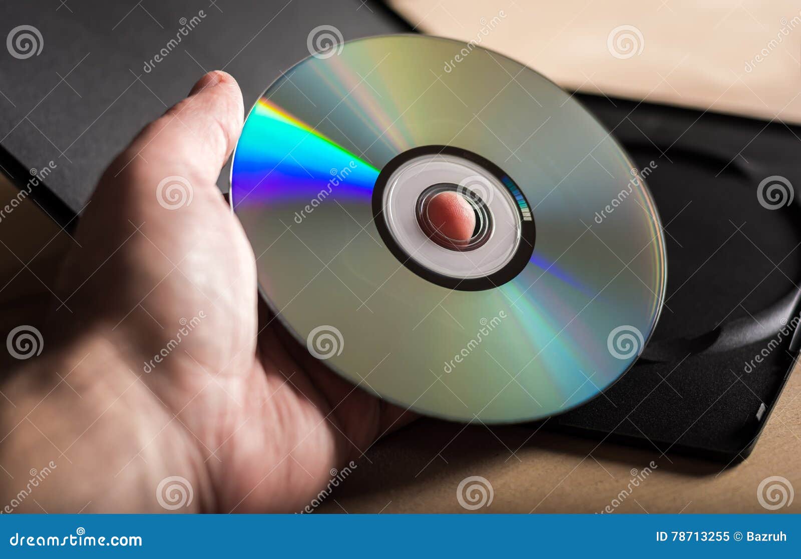 DVD disc in hand stock image. Image of entertainment - 78713255