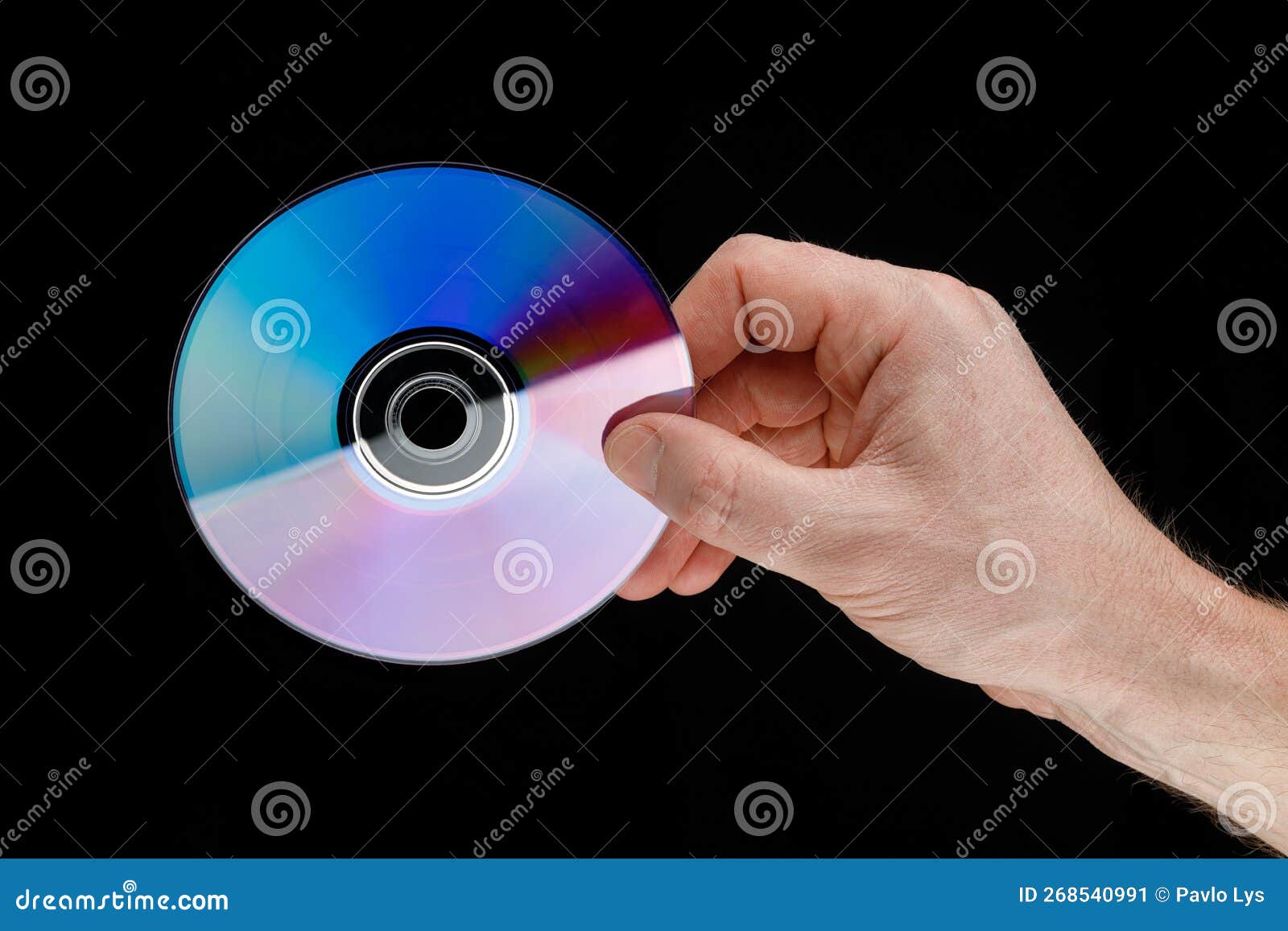 DVD disc in hands on black stock image. Image of circle - 268540991