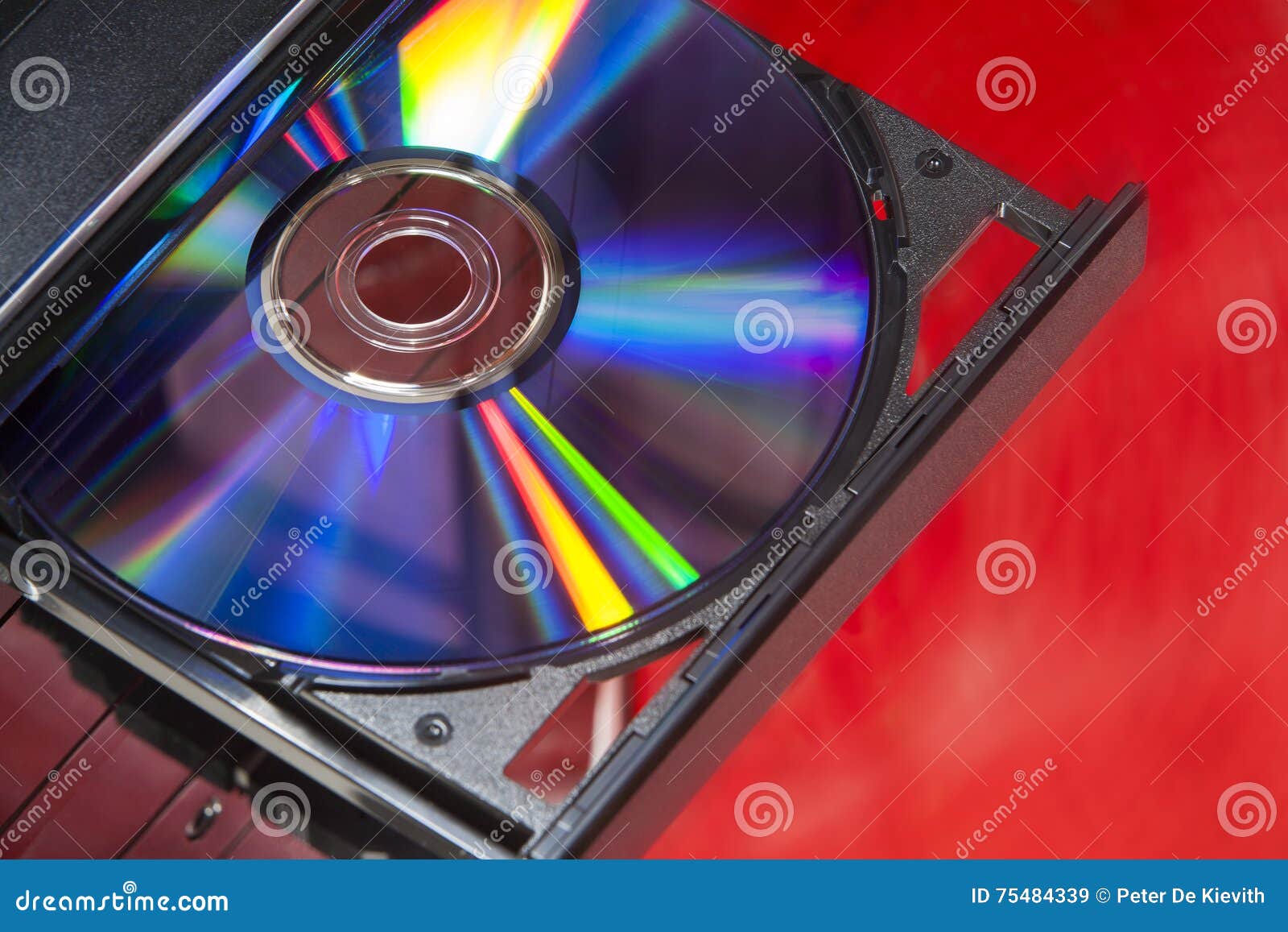 DVD disc in player stock image. Image of insert, music - 75484339