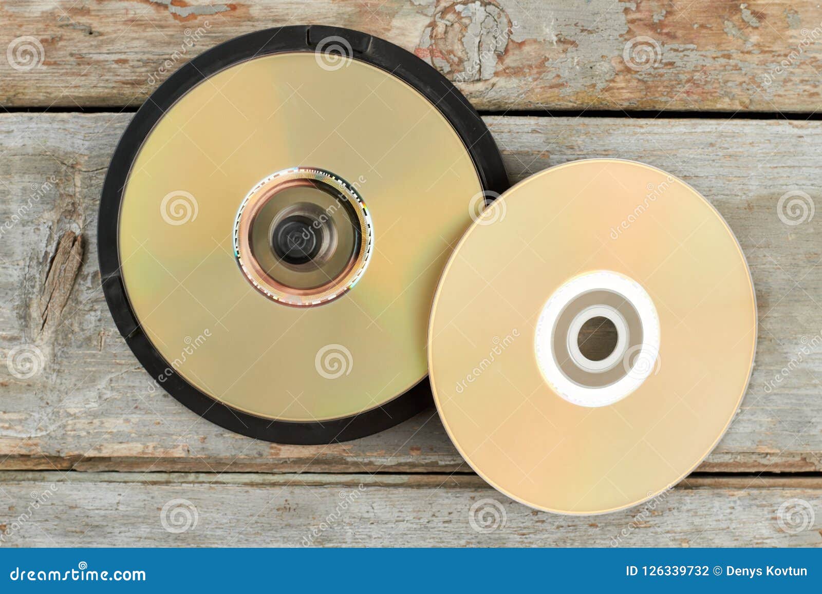 DVD Discs on Old Wooden Background. Stock Photo - Image of plastic ...