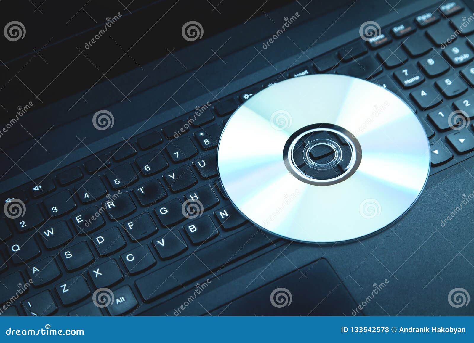 DVD Disk on the Laptop Keyboard Stock Photo - Image of digital, storage ...