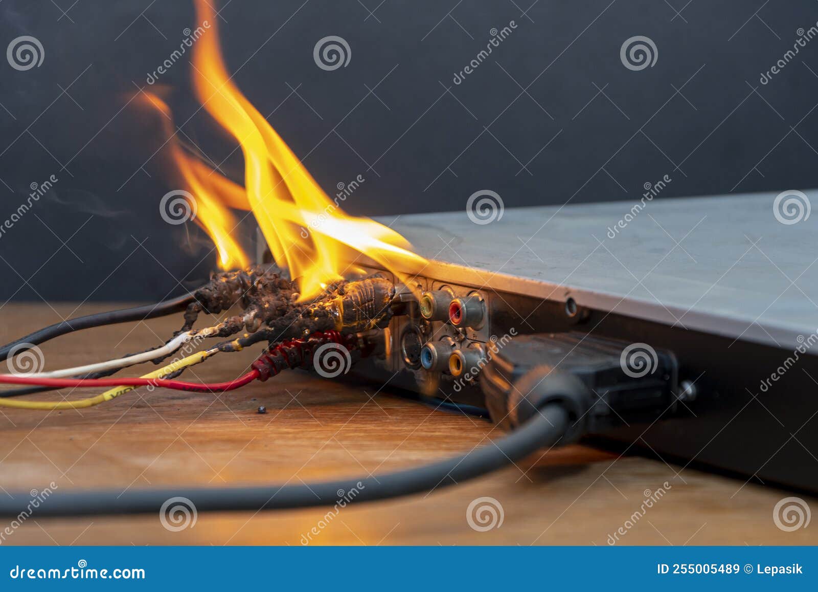 A DVD Player is Burning on the Table, Network Cables are Burning and ...