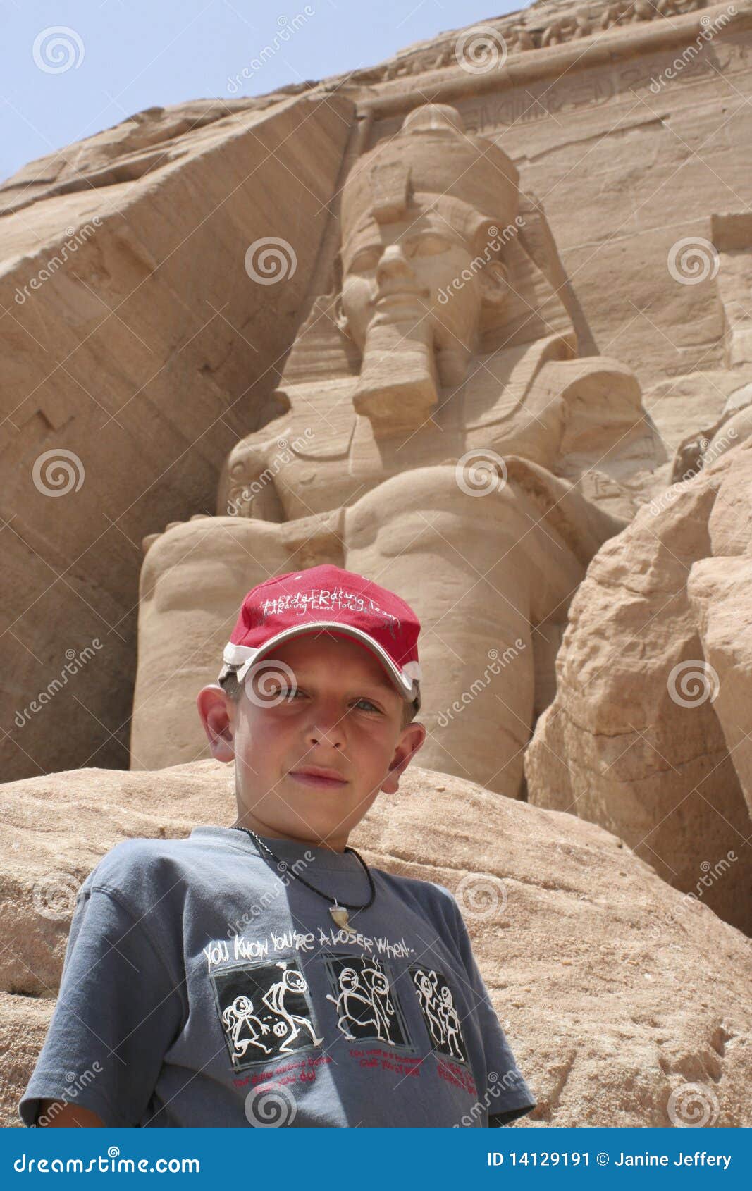 Dwarfed by the statue stock image. Image of colossal - 14129191