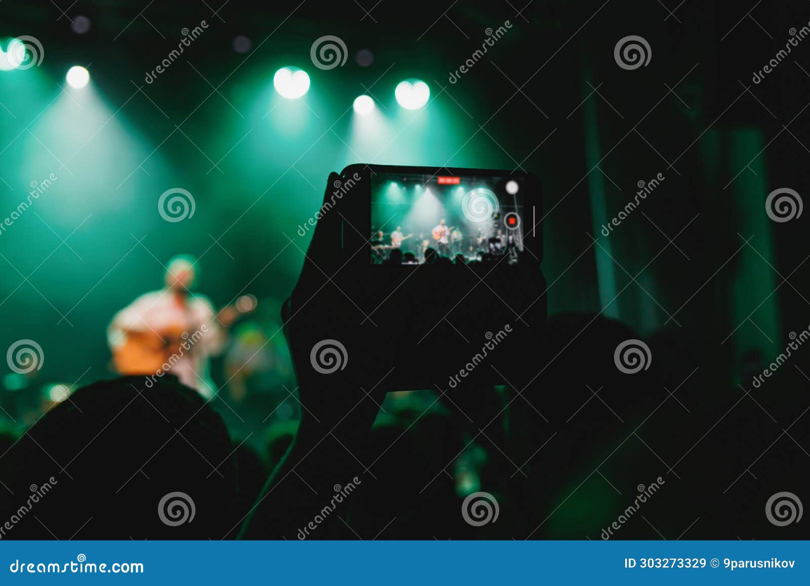 Dynamic Concert Performance with Energetic Audience and Illuminated ...