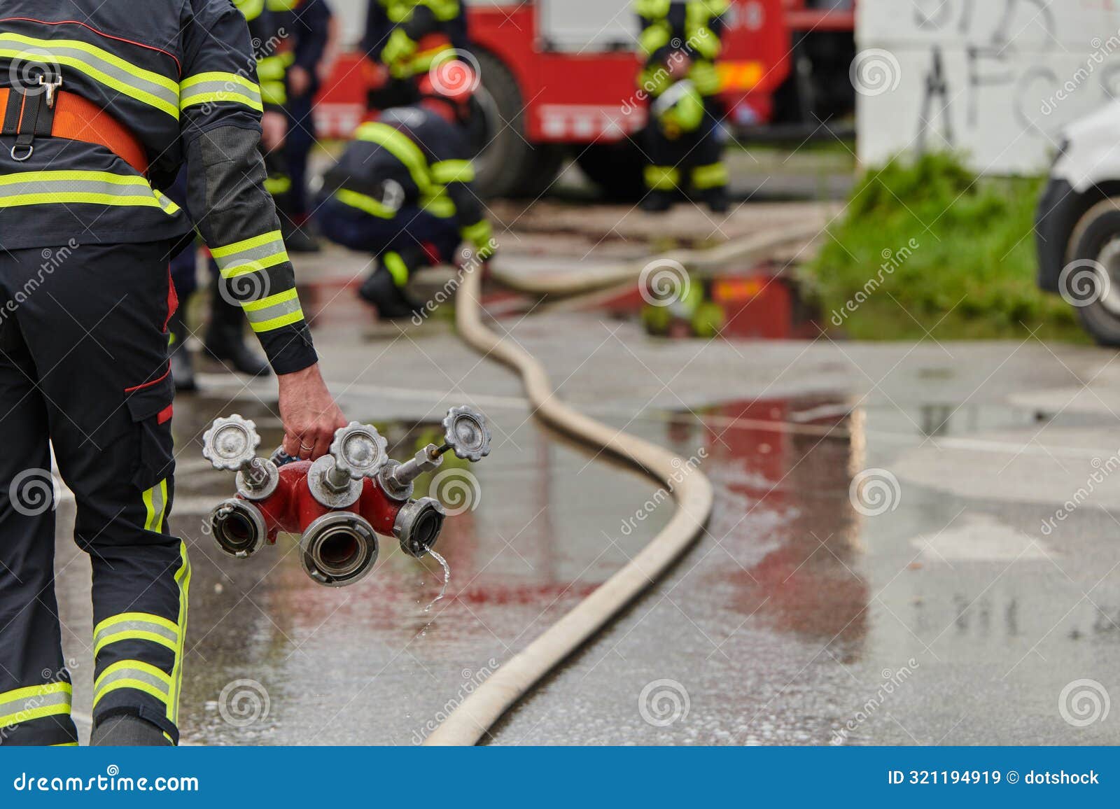 In a Dynamic Display of Synchronized Teamwork, Firefighters Hustle To ...