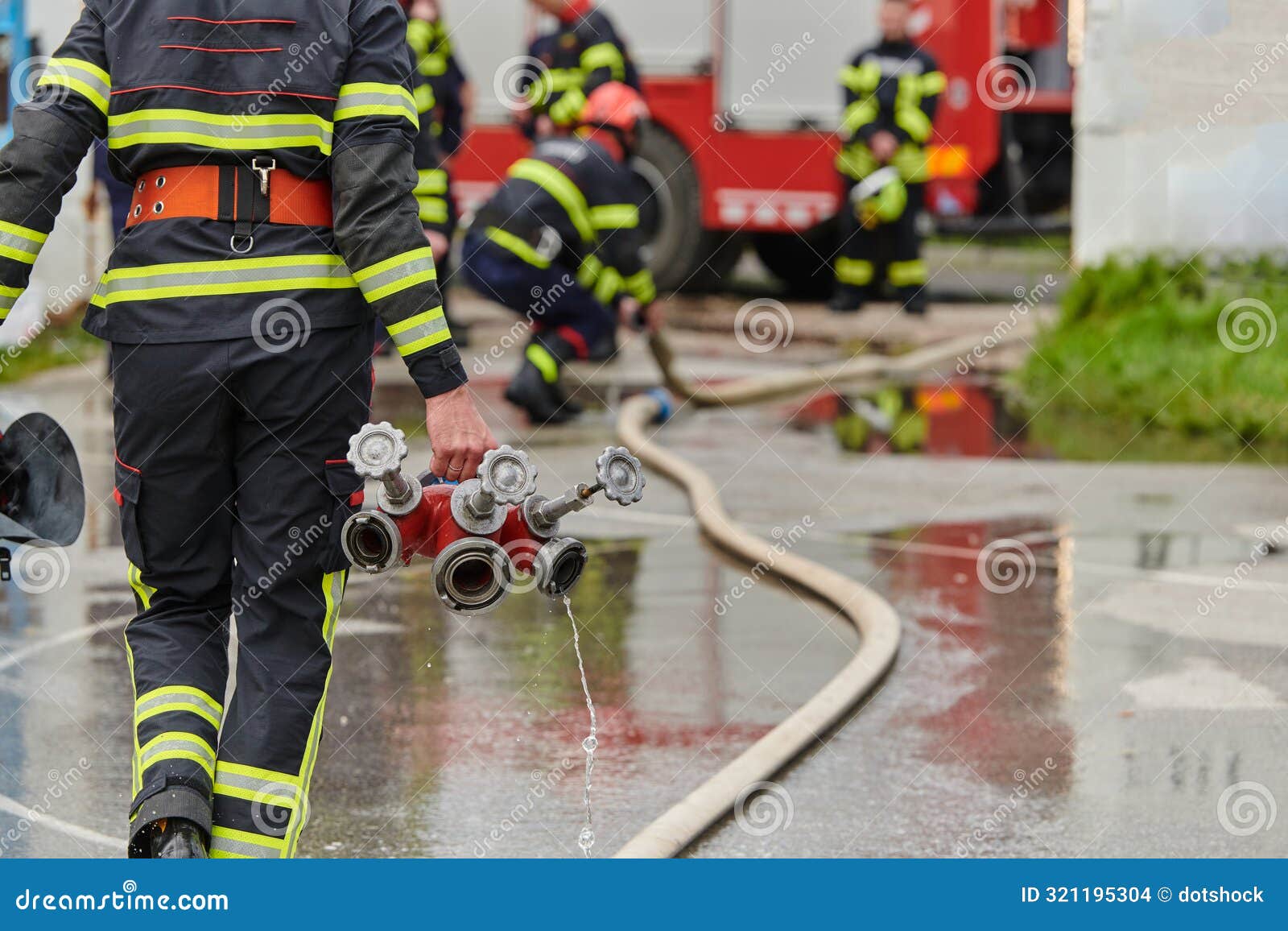 In a Dynamic Display of Synchronized Teamwork, Firefighters Hustle To ...